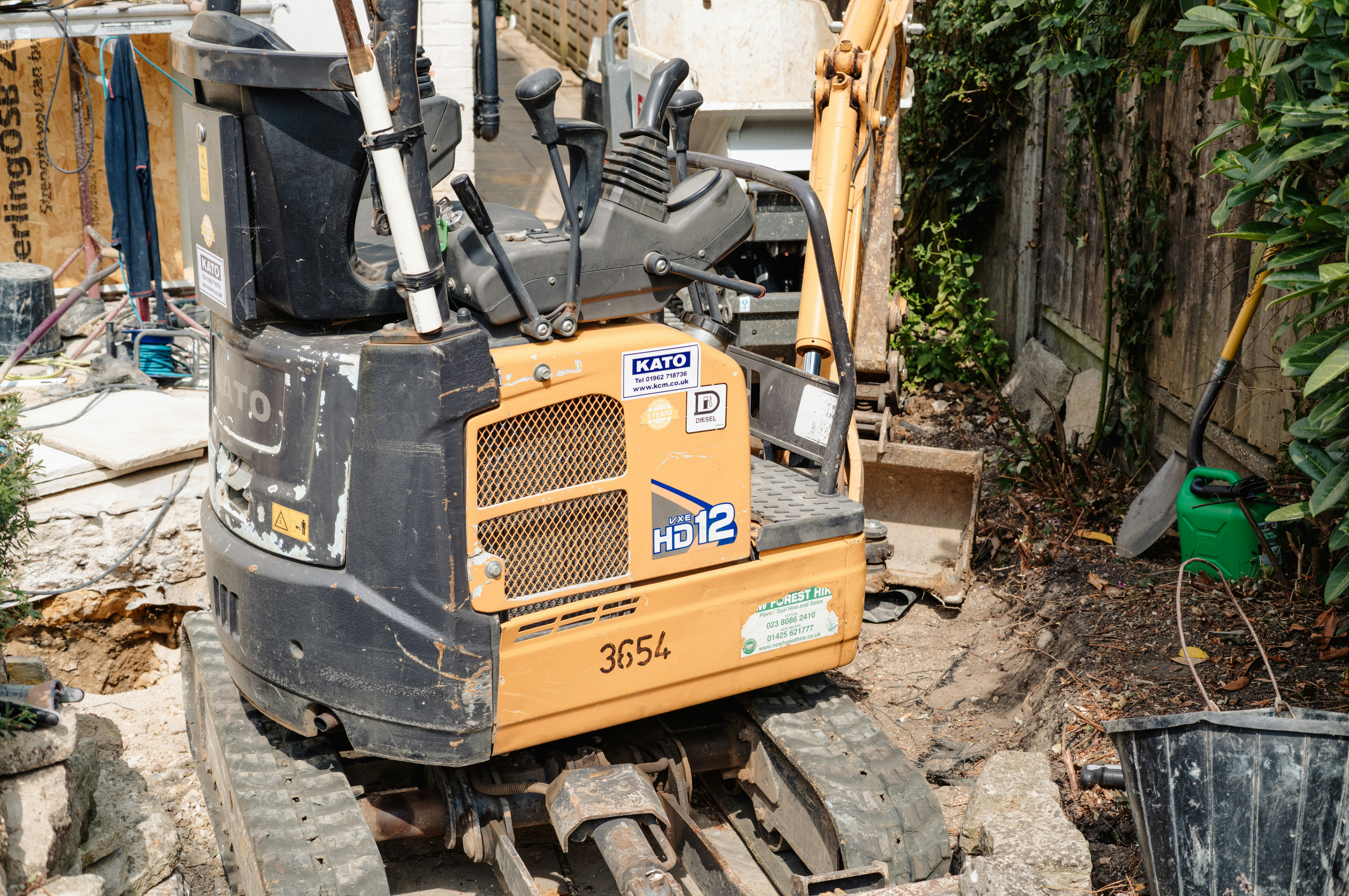 Mini Excavator in a Narrow Construction Alleyway