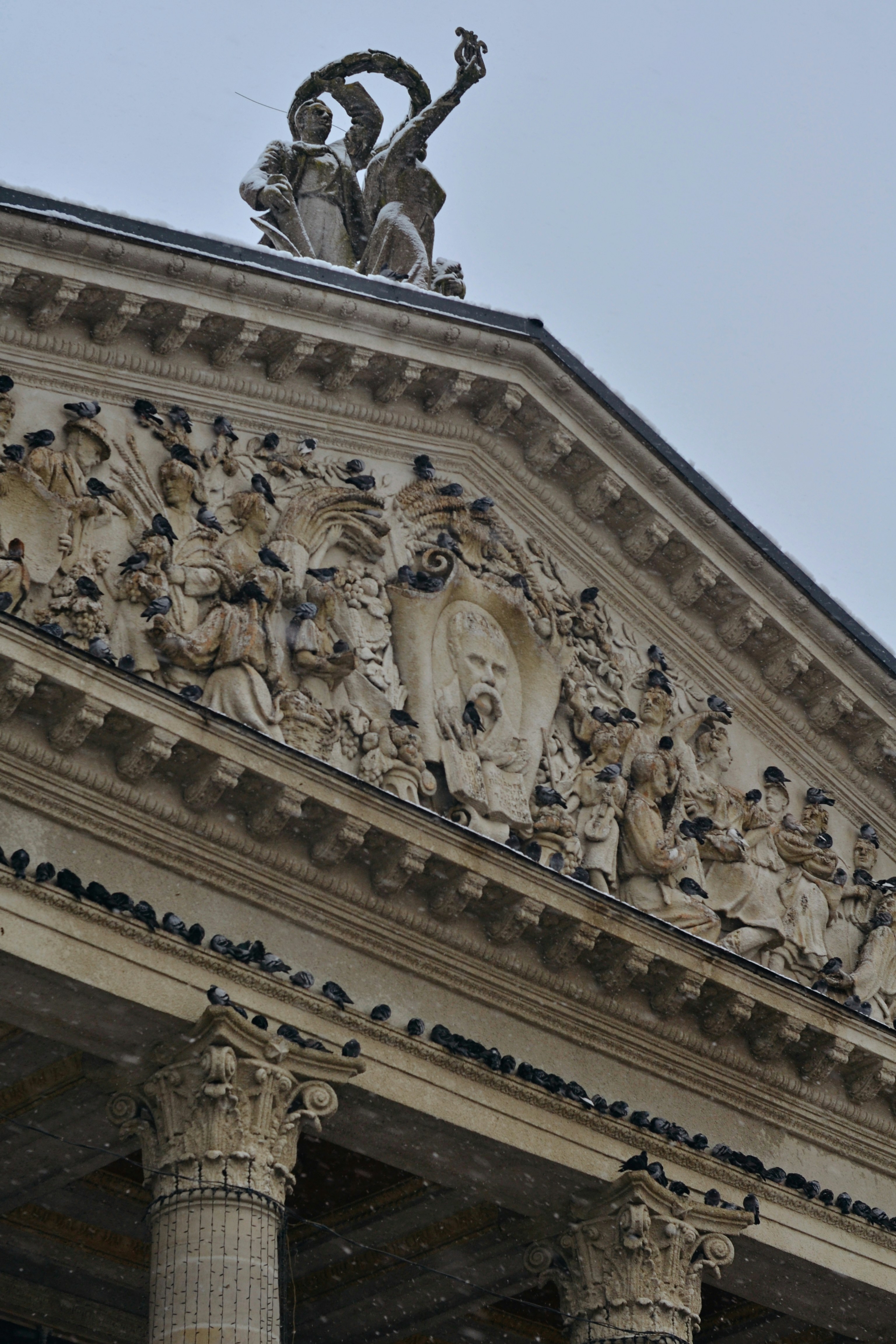 Stone Pediment Portraits: A Carved Chronicle Above the Columned Frieze