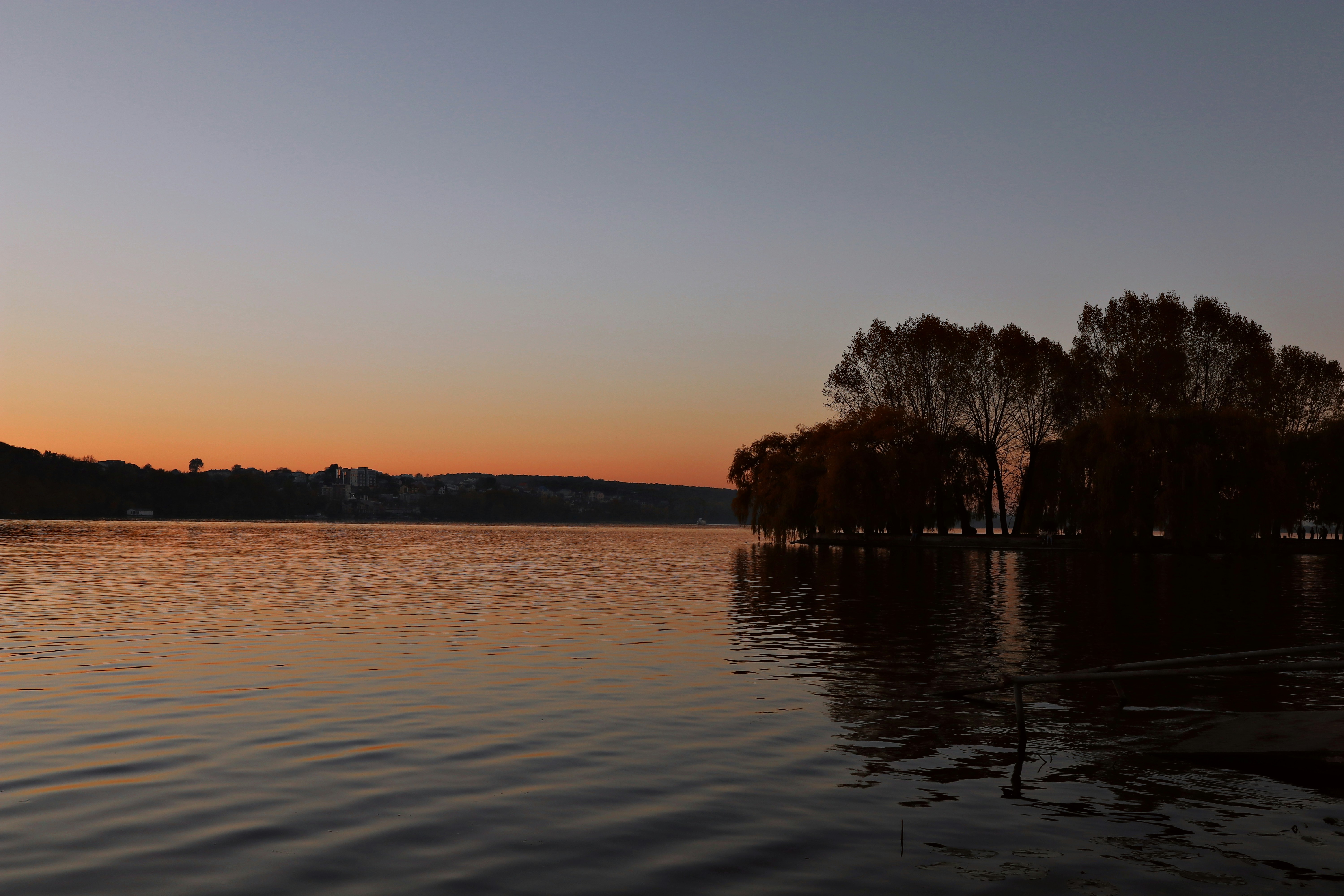 Dusk at the Quiet Lake: Silhouettes and Reflective Waters