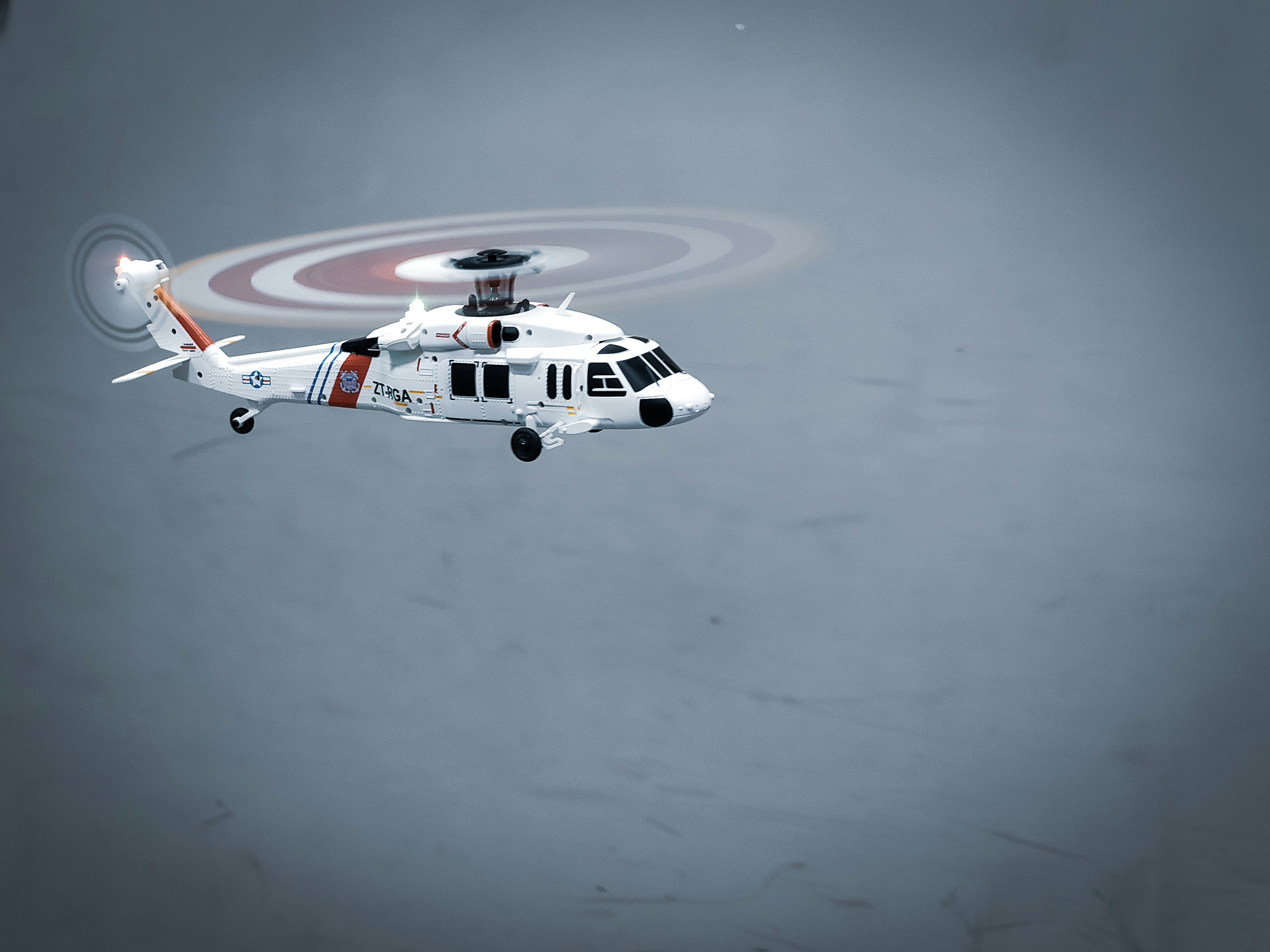  rescues in the blue: a search helicopter hovering above an icy expanse