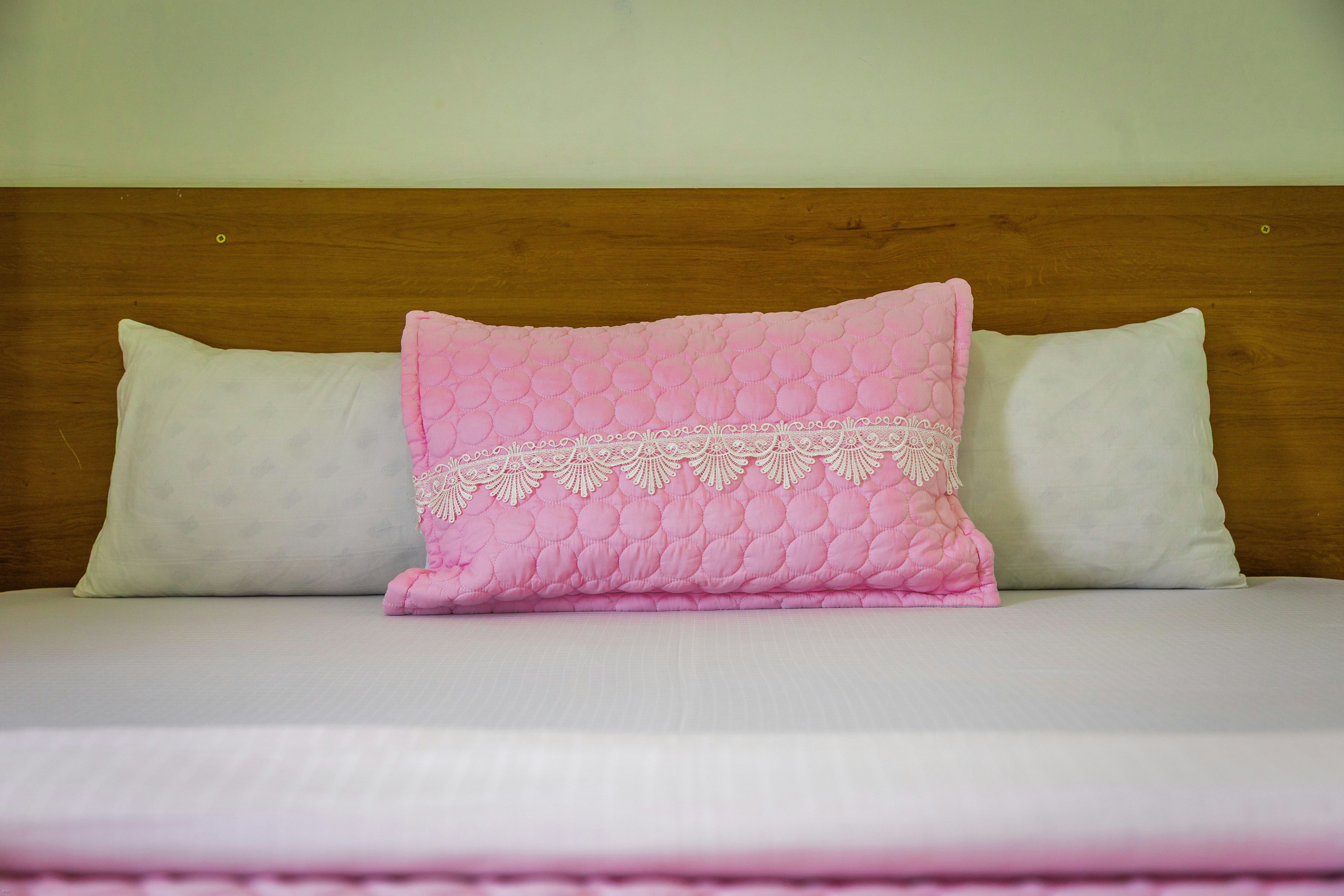 Pastel Pillows on a Quiet Bedscape