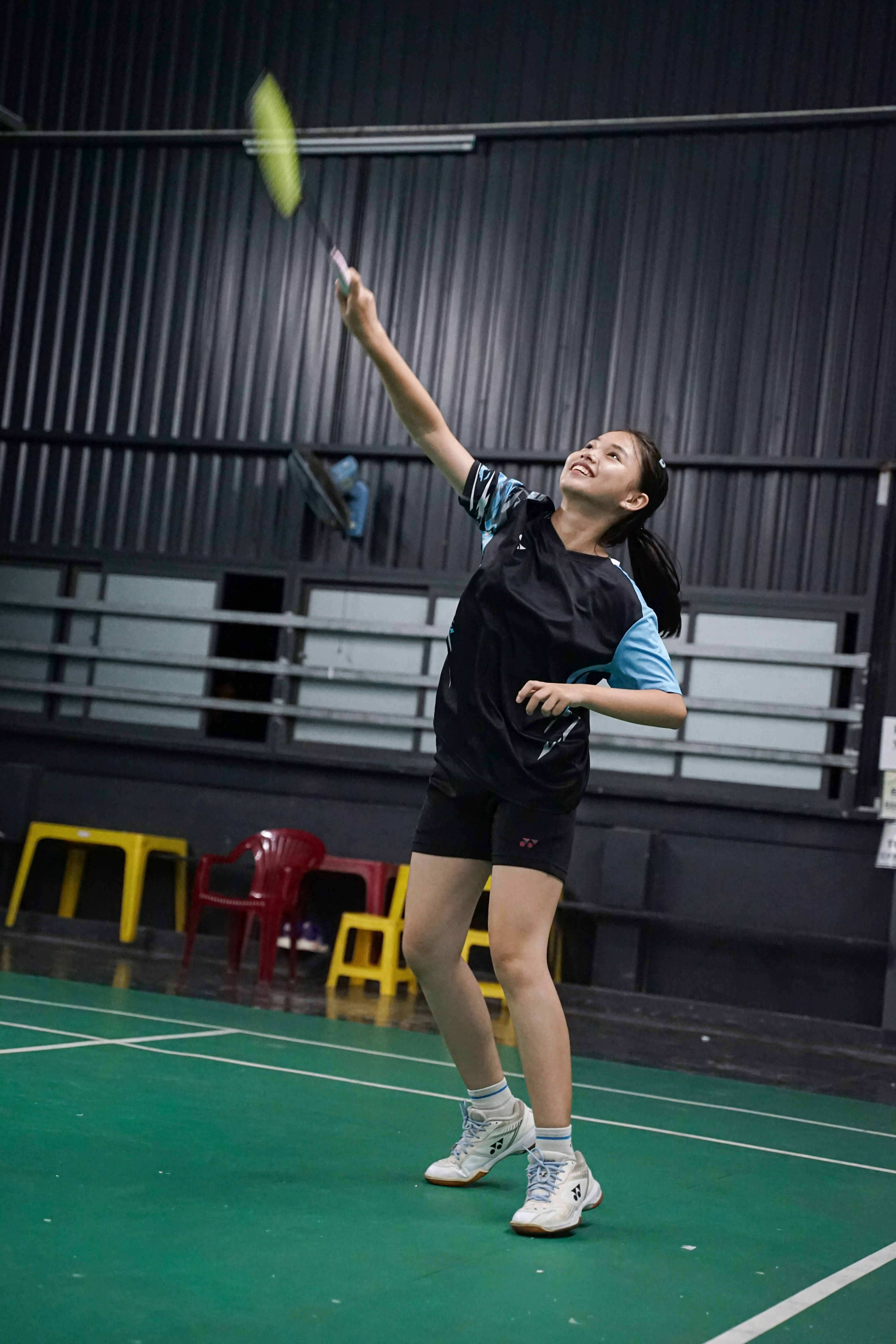 Swinging to Victory: A Moment in Mid-Serve on Court