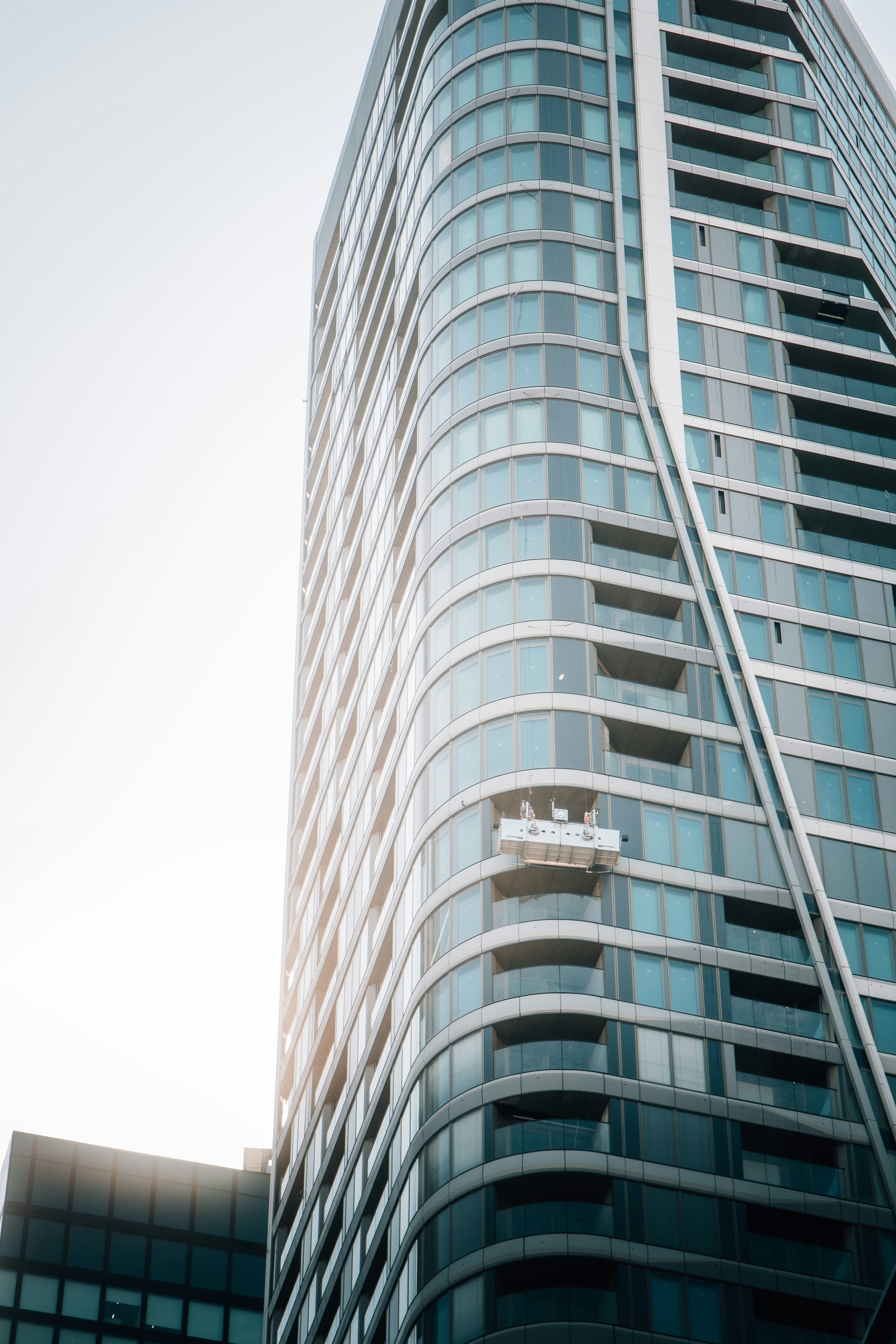 Edge of Glass: A Skyscraper’s Curved Facade Reaching the Sky