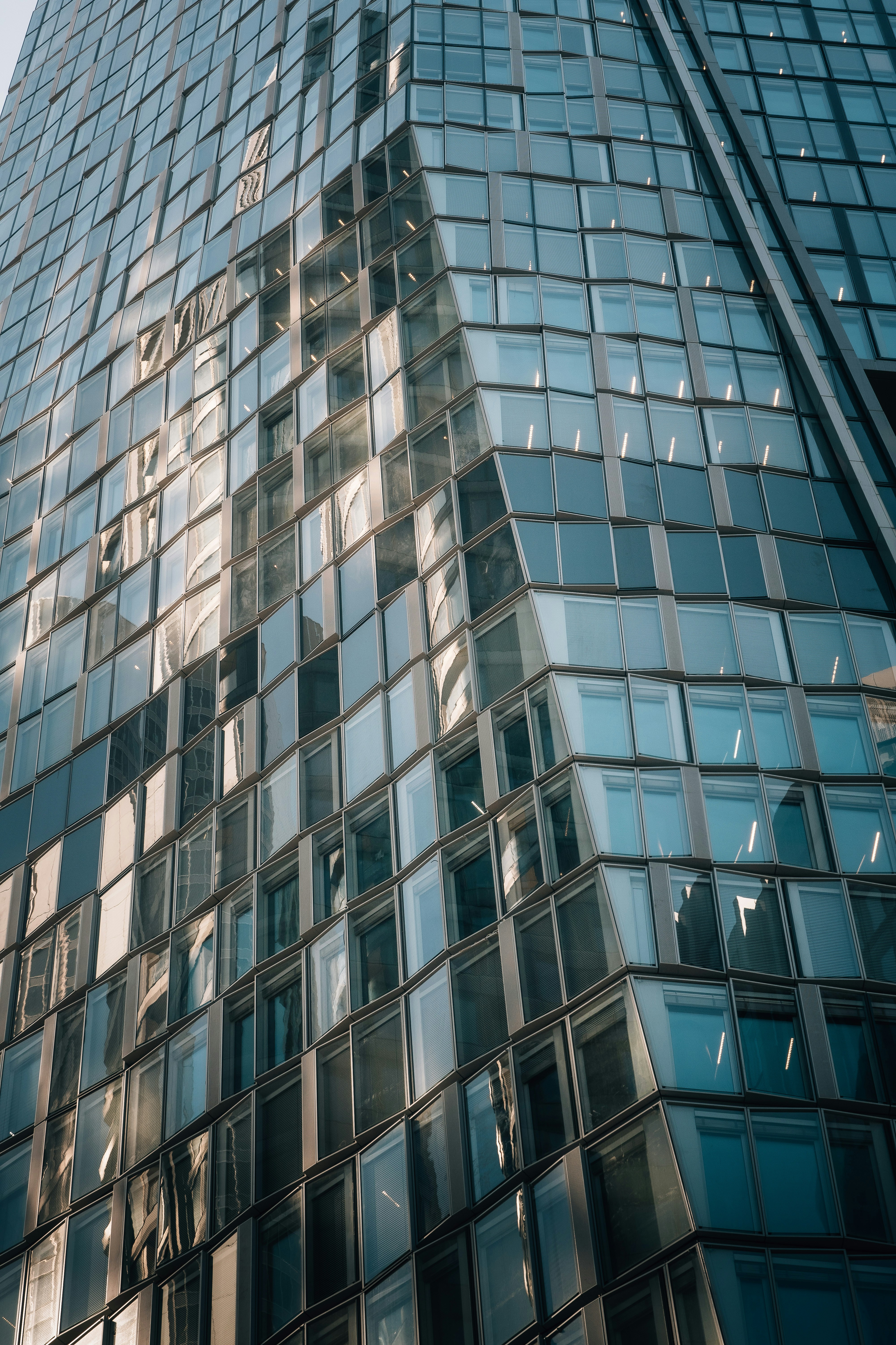 Glass Grid: Reflections Cascading Across a Skyscraper Facade