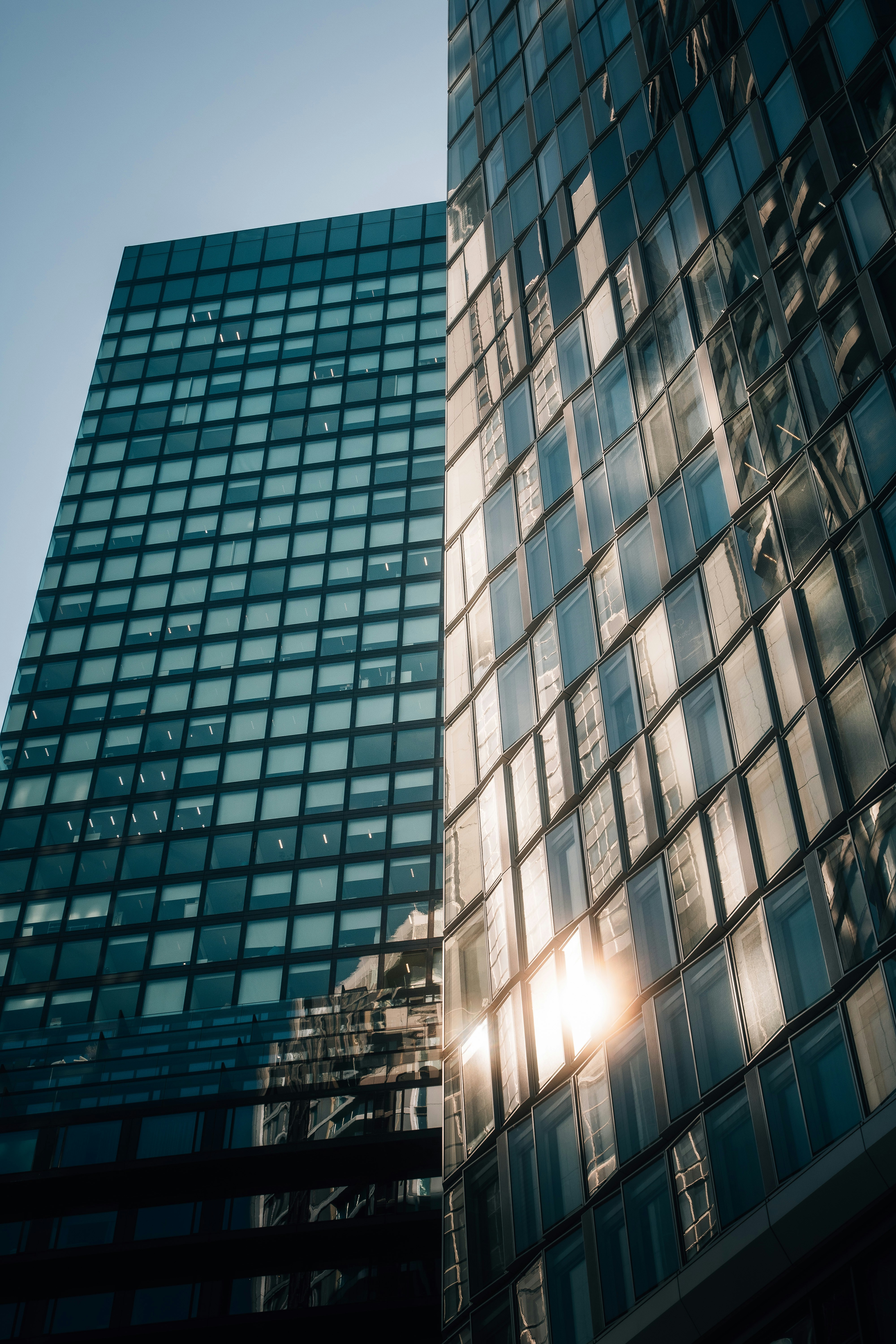 Intersecting Glass: Sunlit Facades in a City Tilt