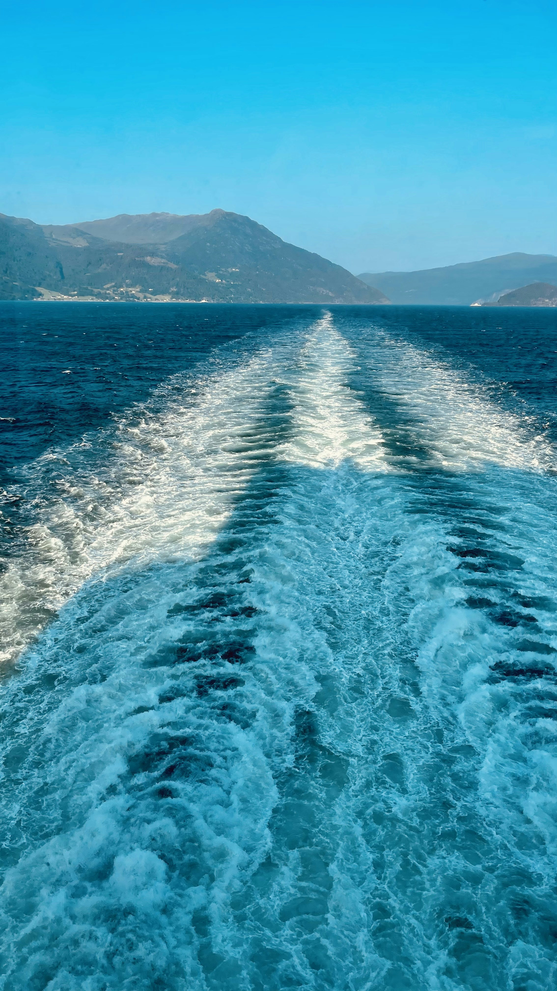 A Turquoise Wake Carving Toward Blue Horizons
