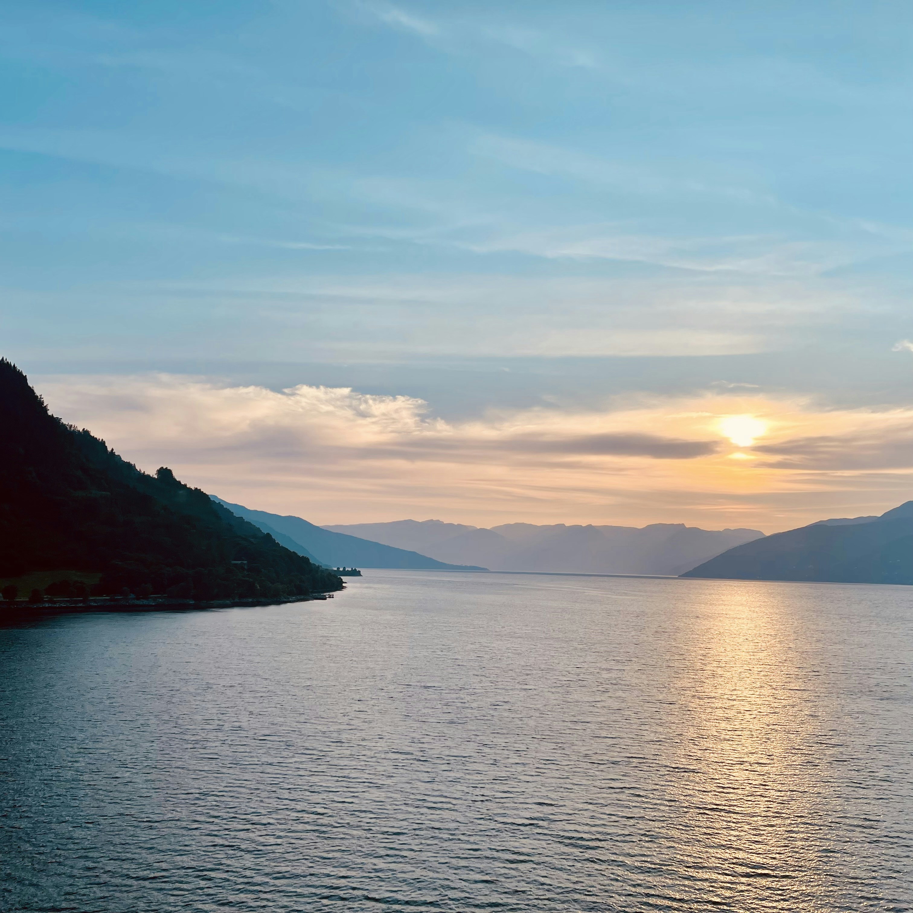 Sunlit Fjord: A Quiet Horizon Drenched in Golden Light