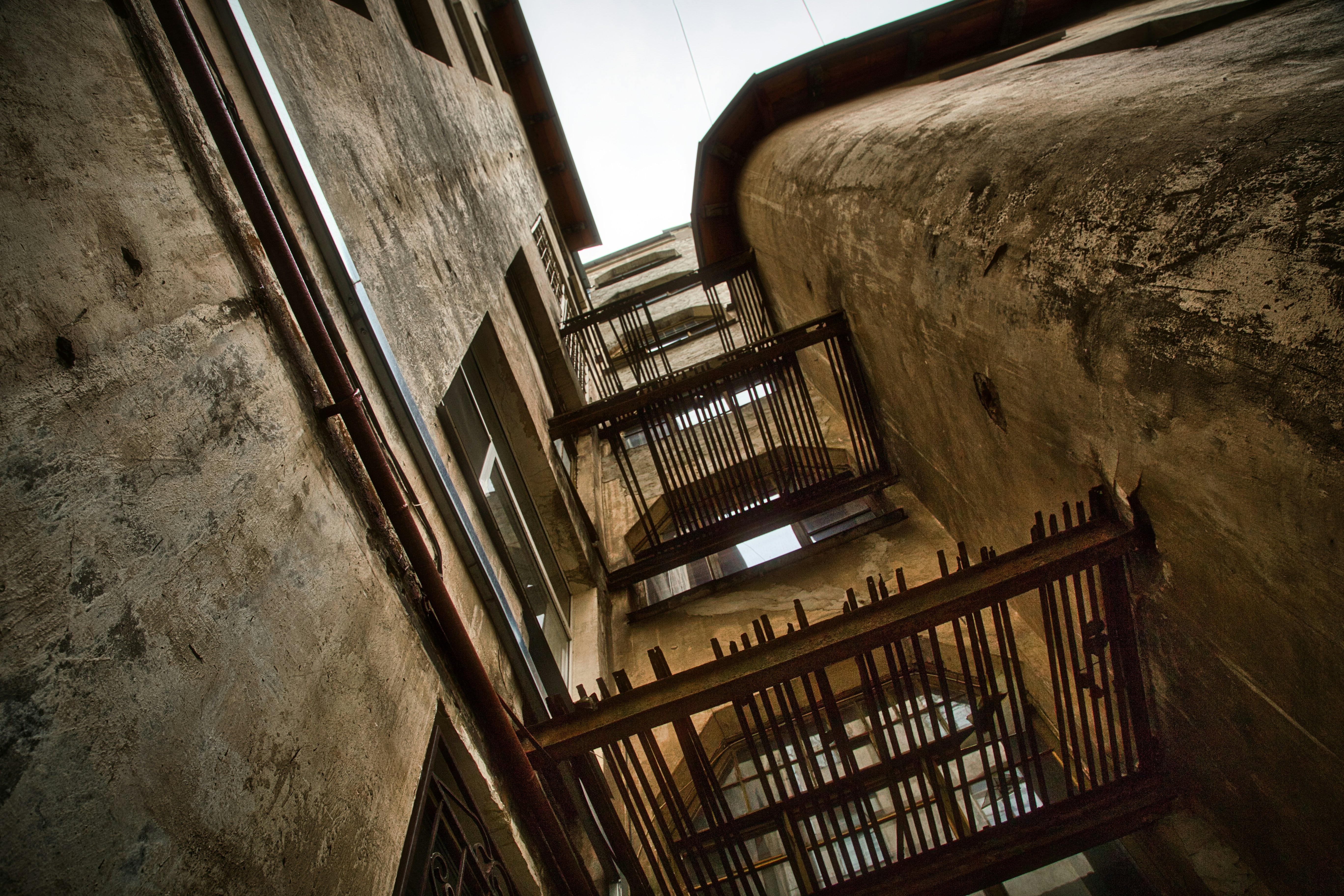 Caged Light: An Atrium of Rust and Echoes