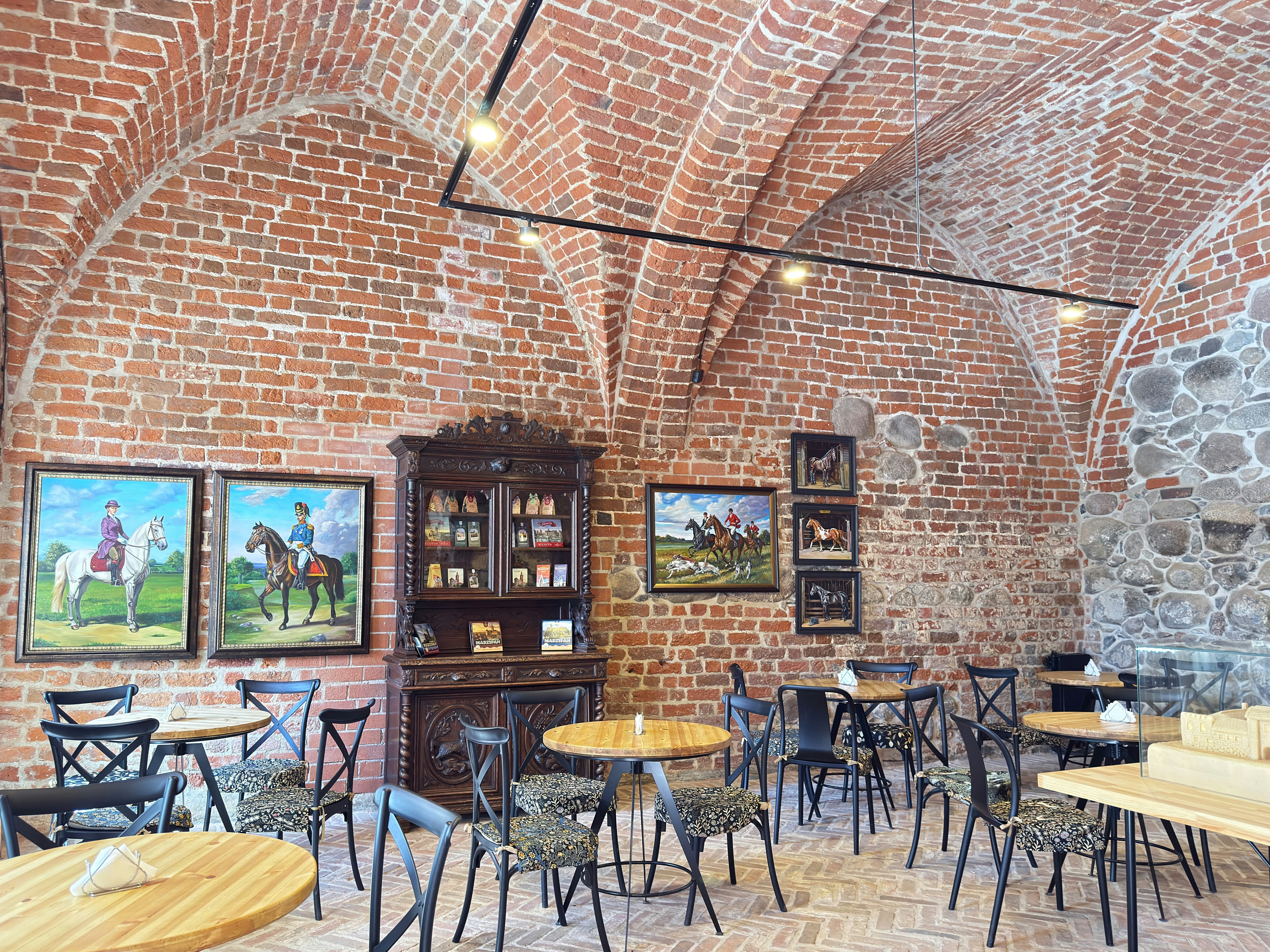 Brick Arches and Painted Tales: A Quiet Café Gallery
