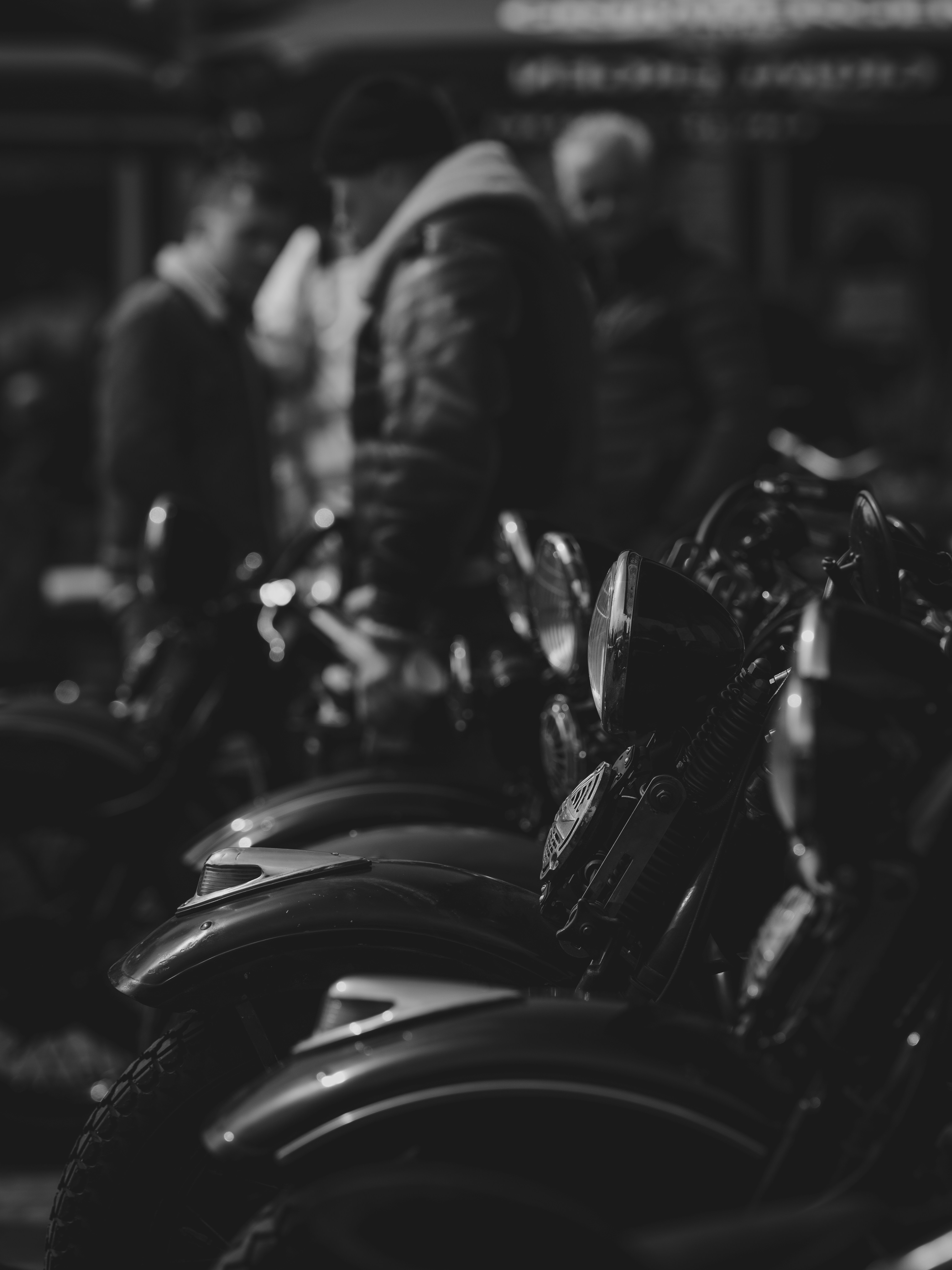 Row of Night-parked Motorbikes: Quiet in the Neon Grip