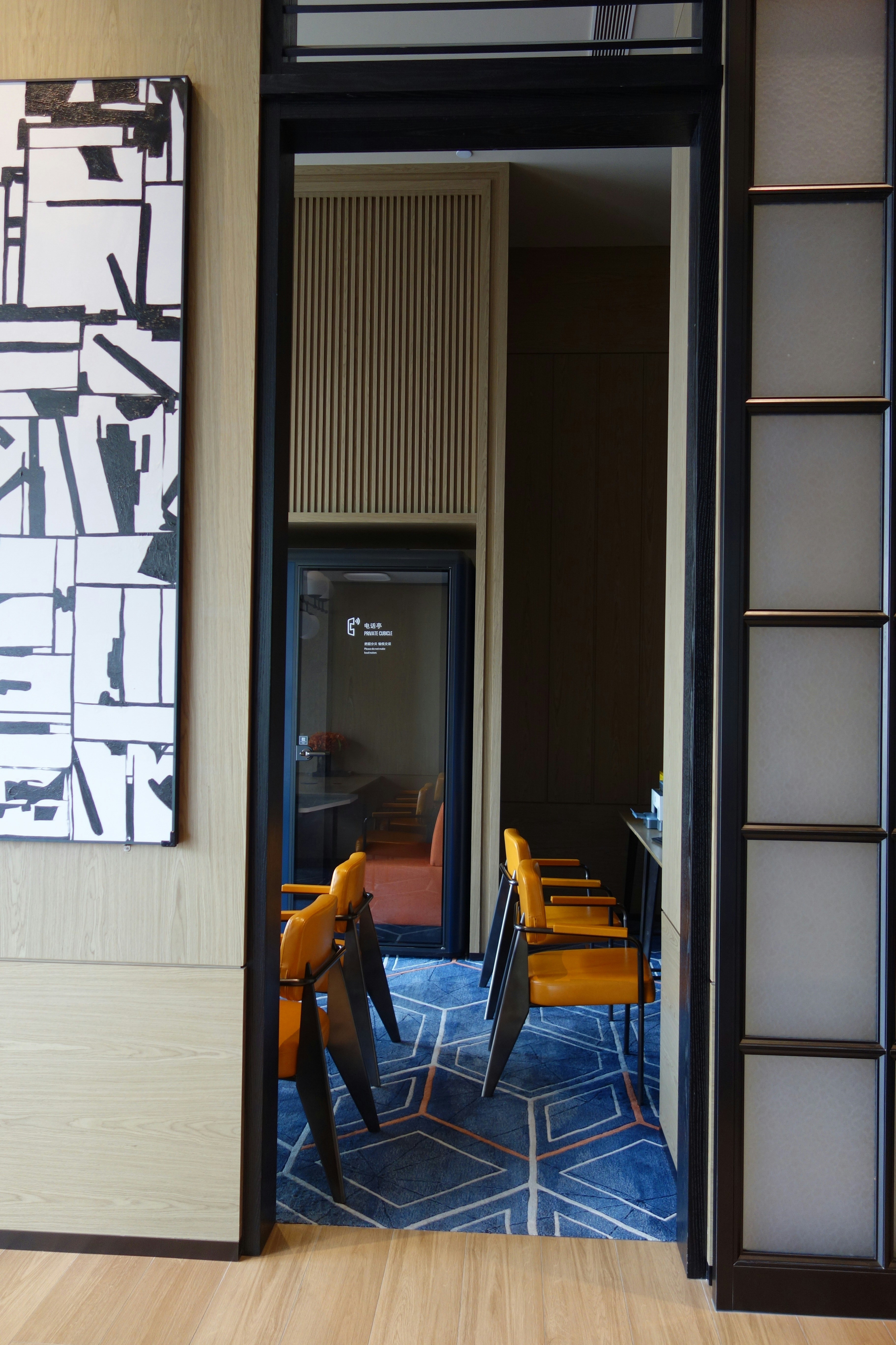 Open doorway to the café's geometric interior