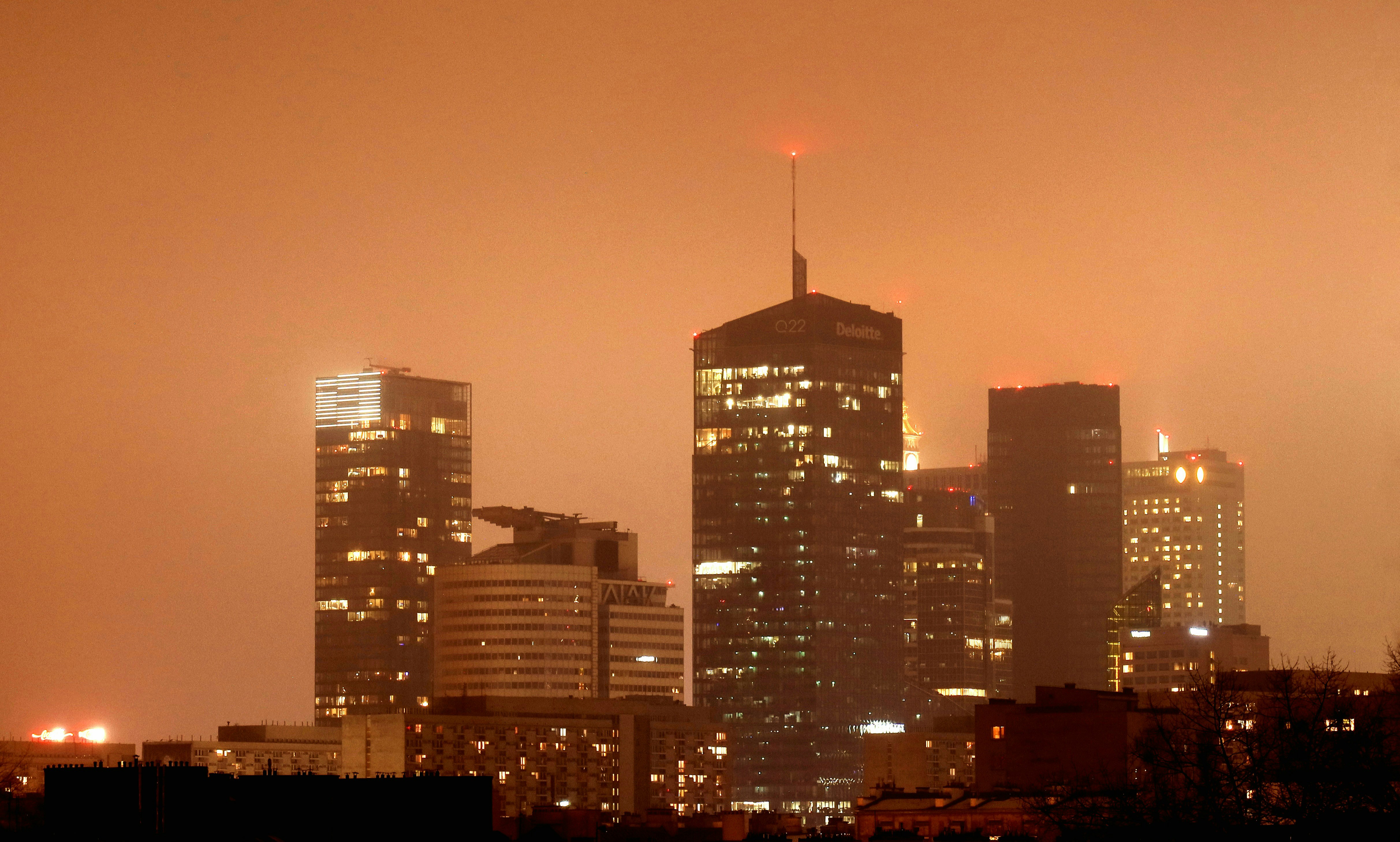 Midnight Nebula: City Silhouette Behind Orange Haze