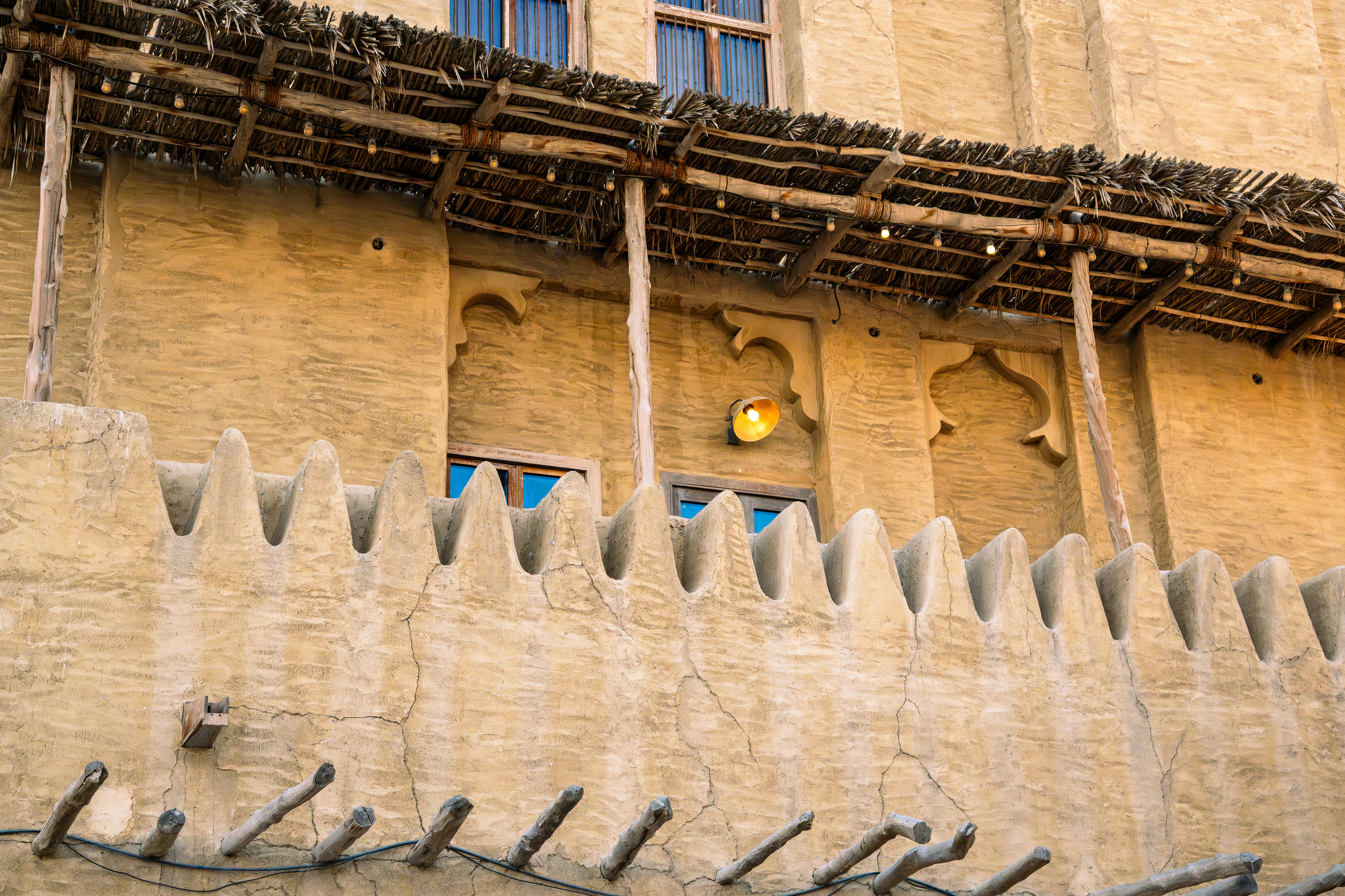 Sunlit Detail on a Traditional Mud Brick Balcony