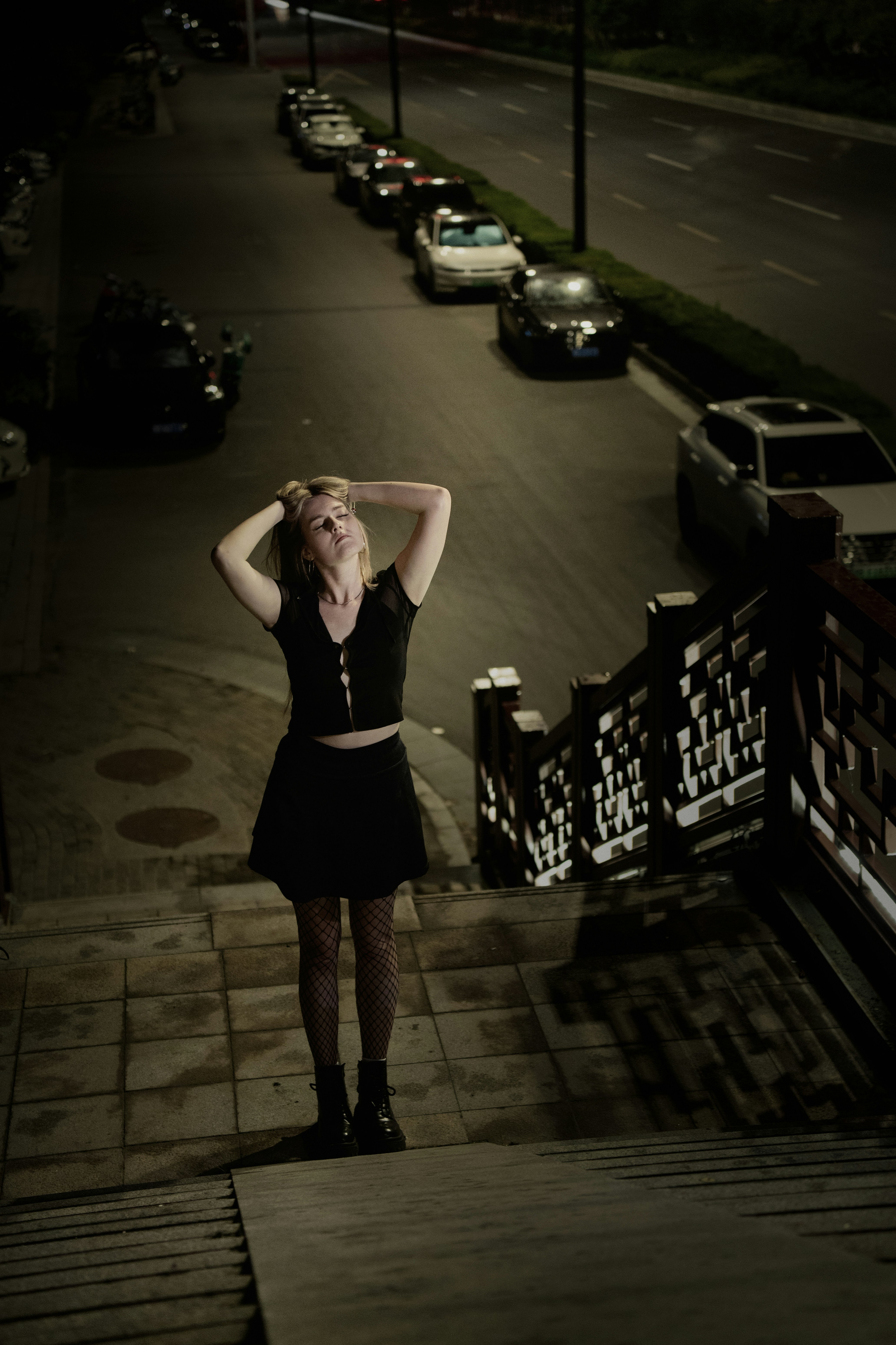 Nightbound Edge: A lone figure under urban glow