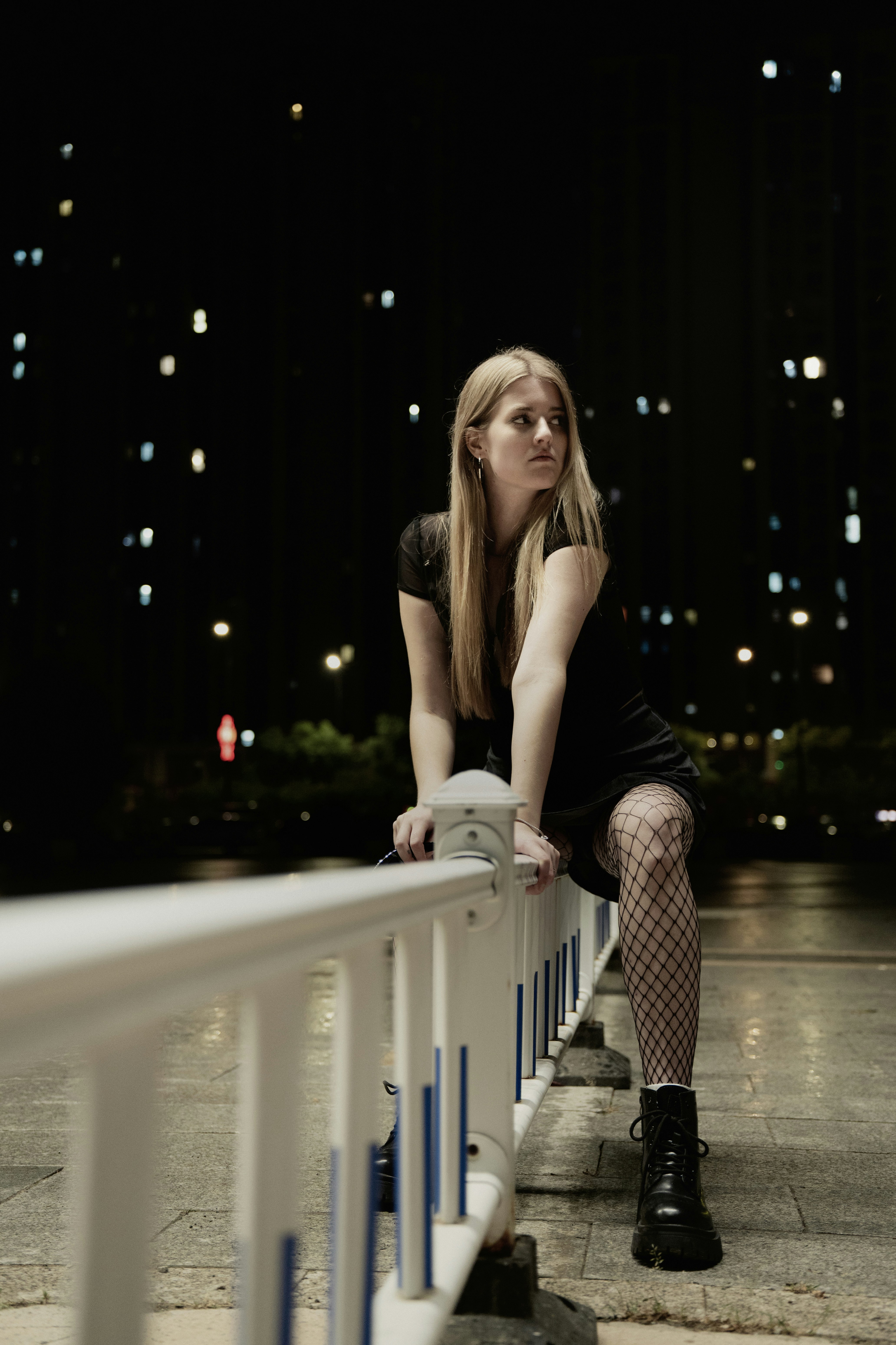 Midnight on the Railing: A Night Portrait on the Waterfront