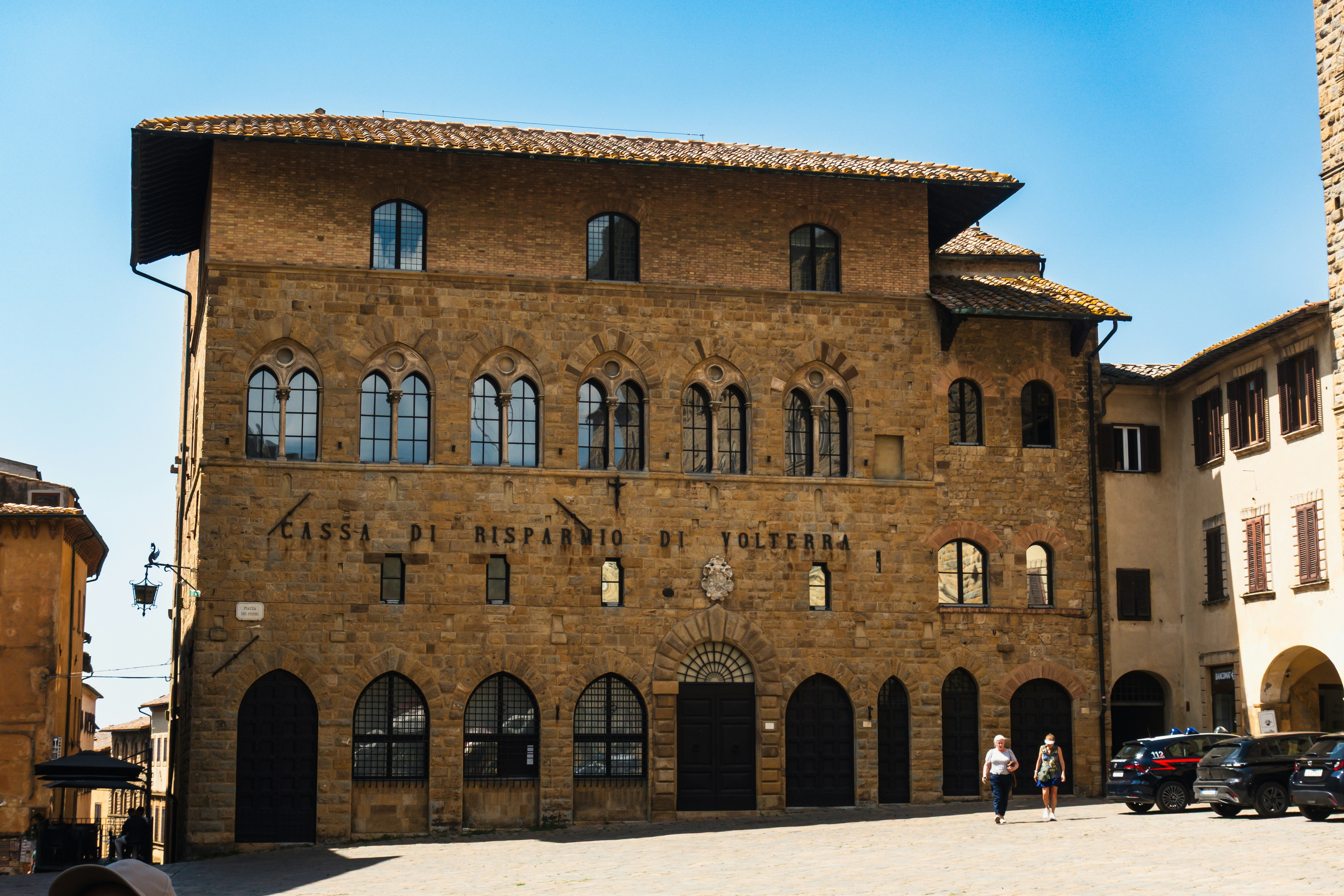 Historic Tuscan Facade: A Sunlit Arcade and Courtyard