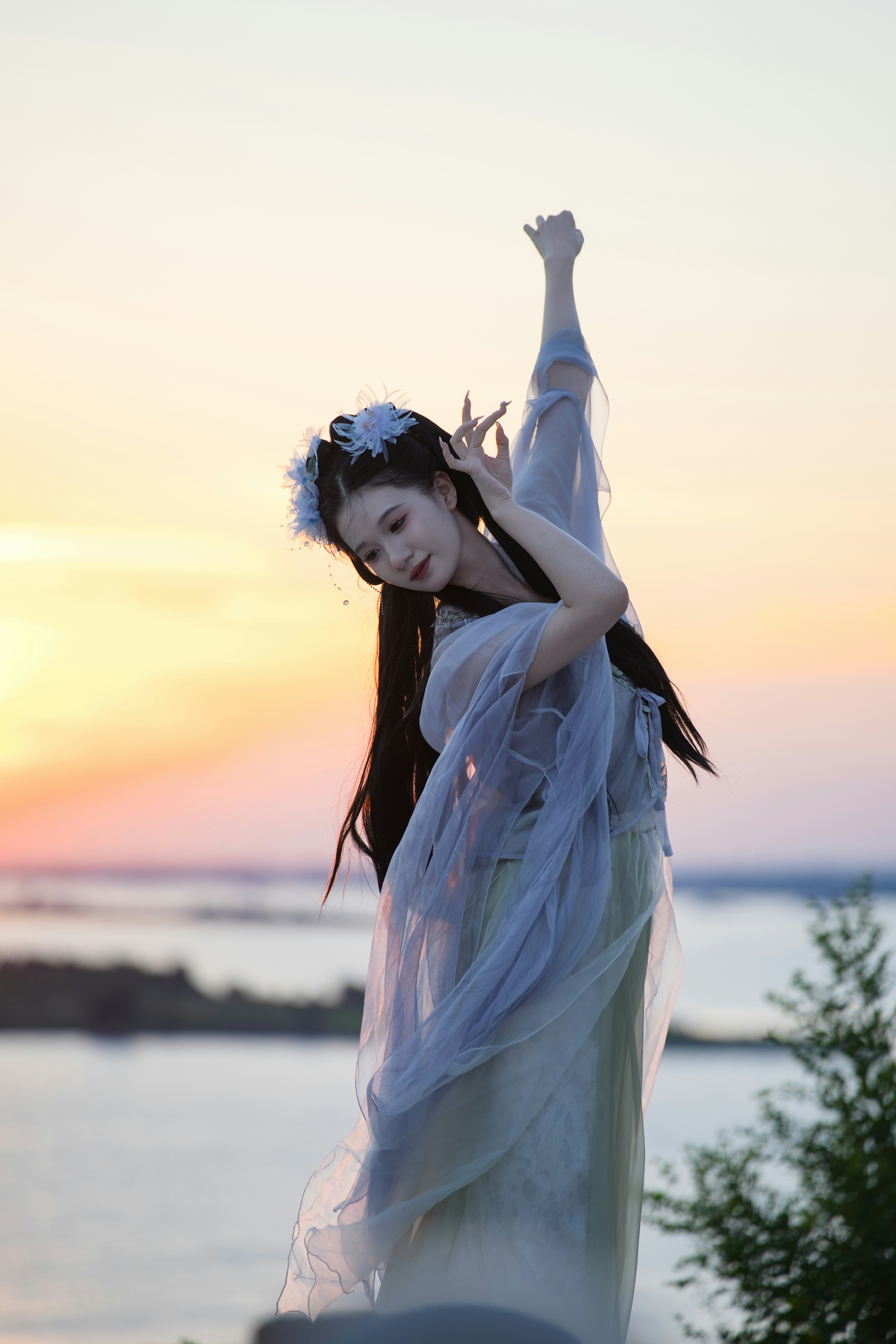 Sunset Silk: A Dancer in Translucent Veil by the Still Water