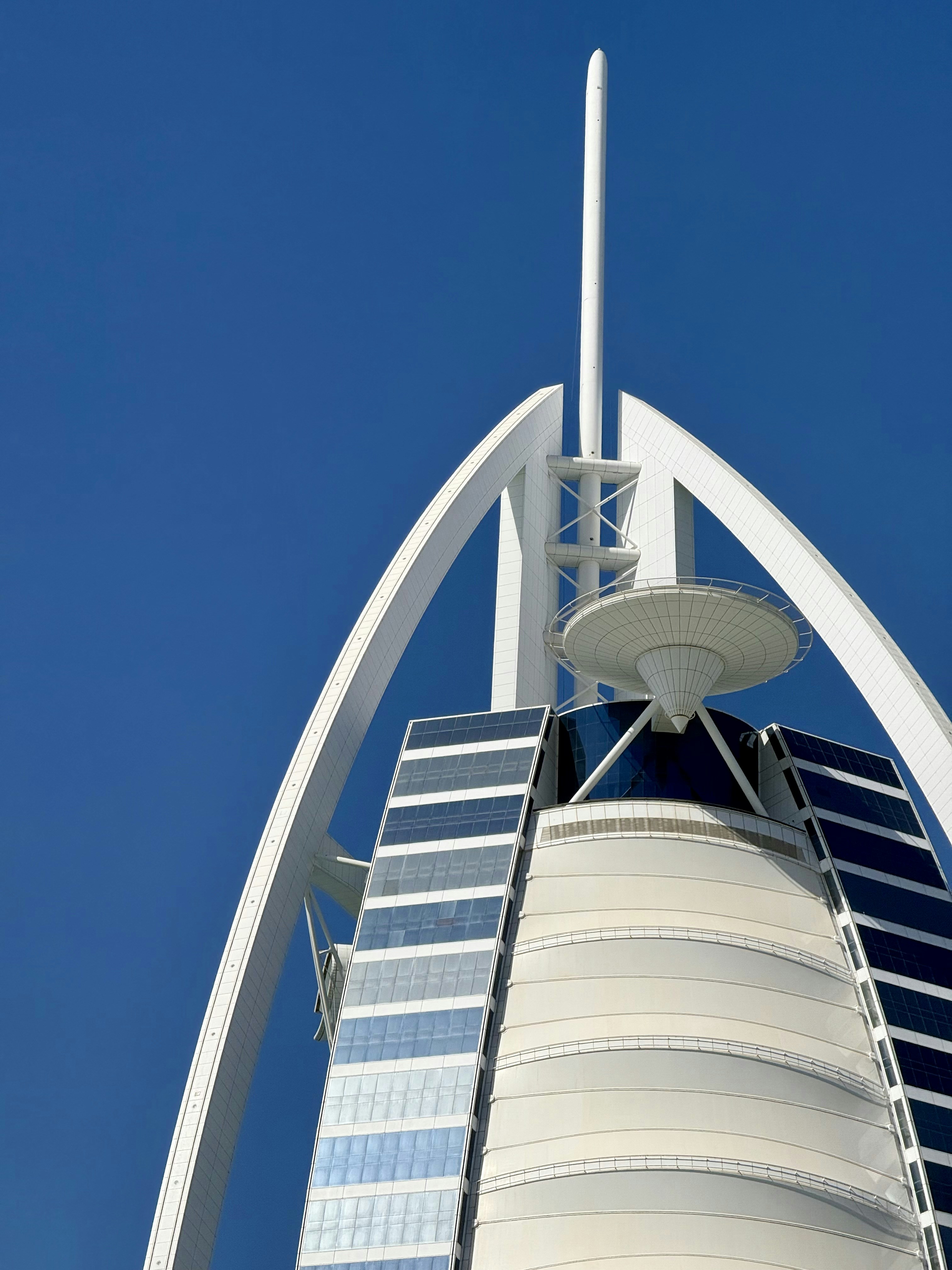 Sail of Steel: Burj Al Arab's Arc and Deck Tower Reaching the Sky