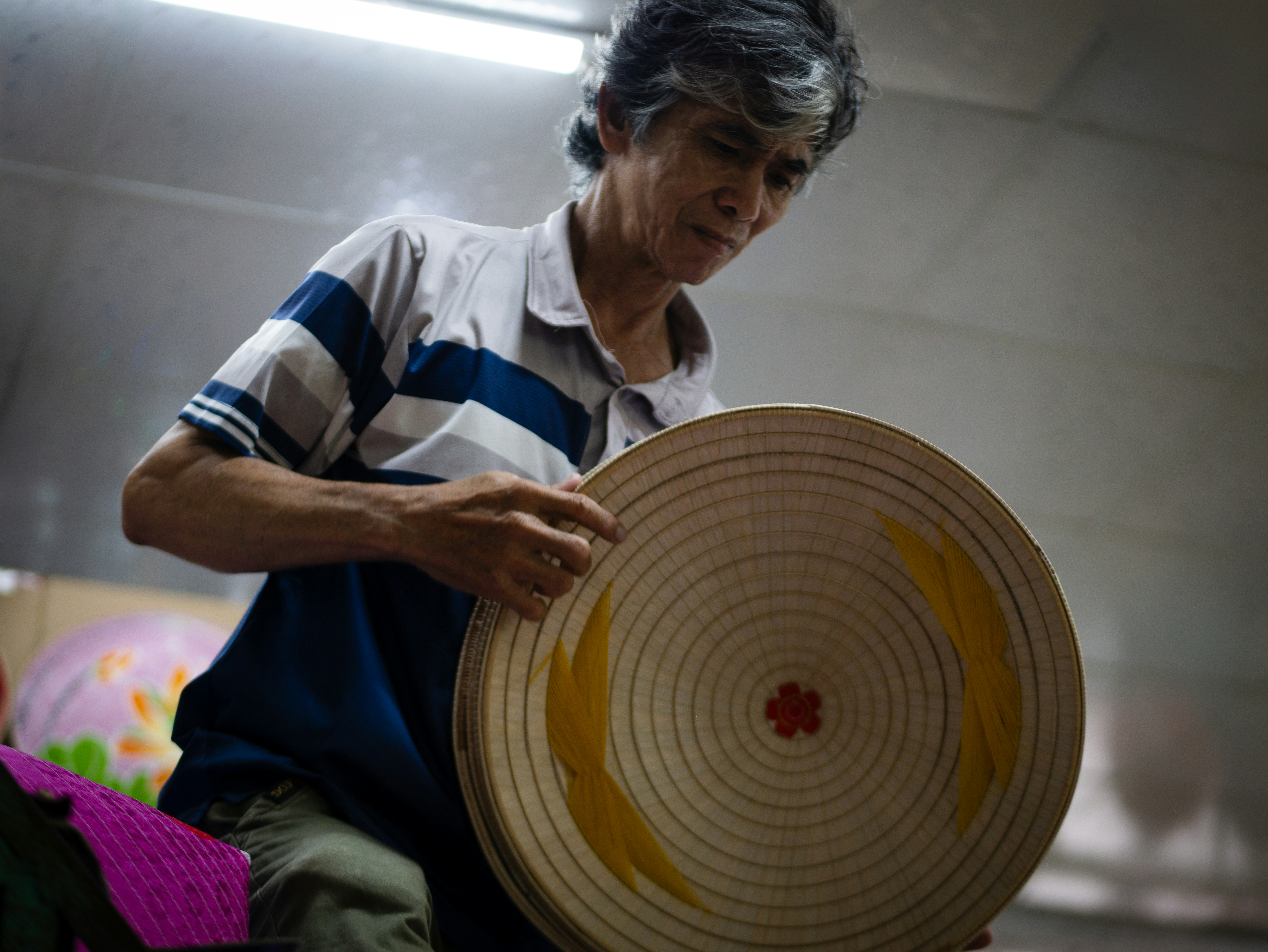 Careful Hands and Circular Craft: A Craftsperson at Work with a Concentric Hatched Medium