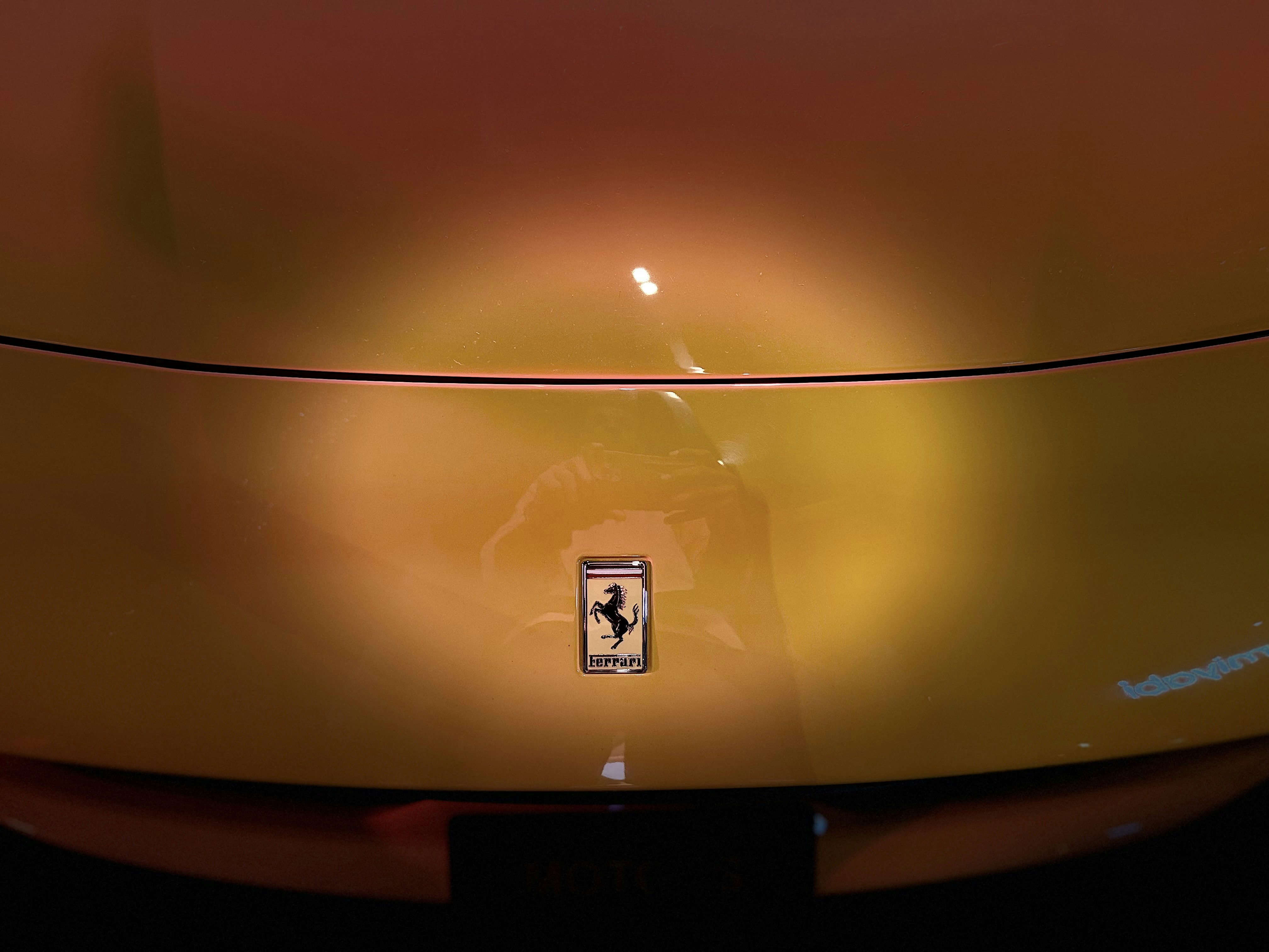 Ferrari Emblem Stare: A Glimpse at the Yellow Contour