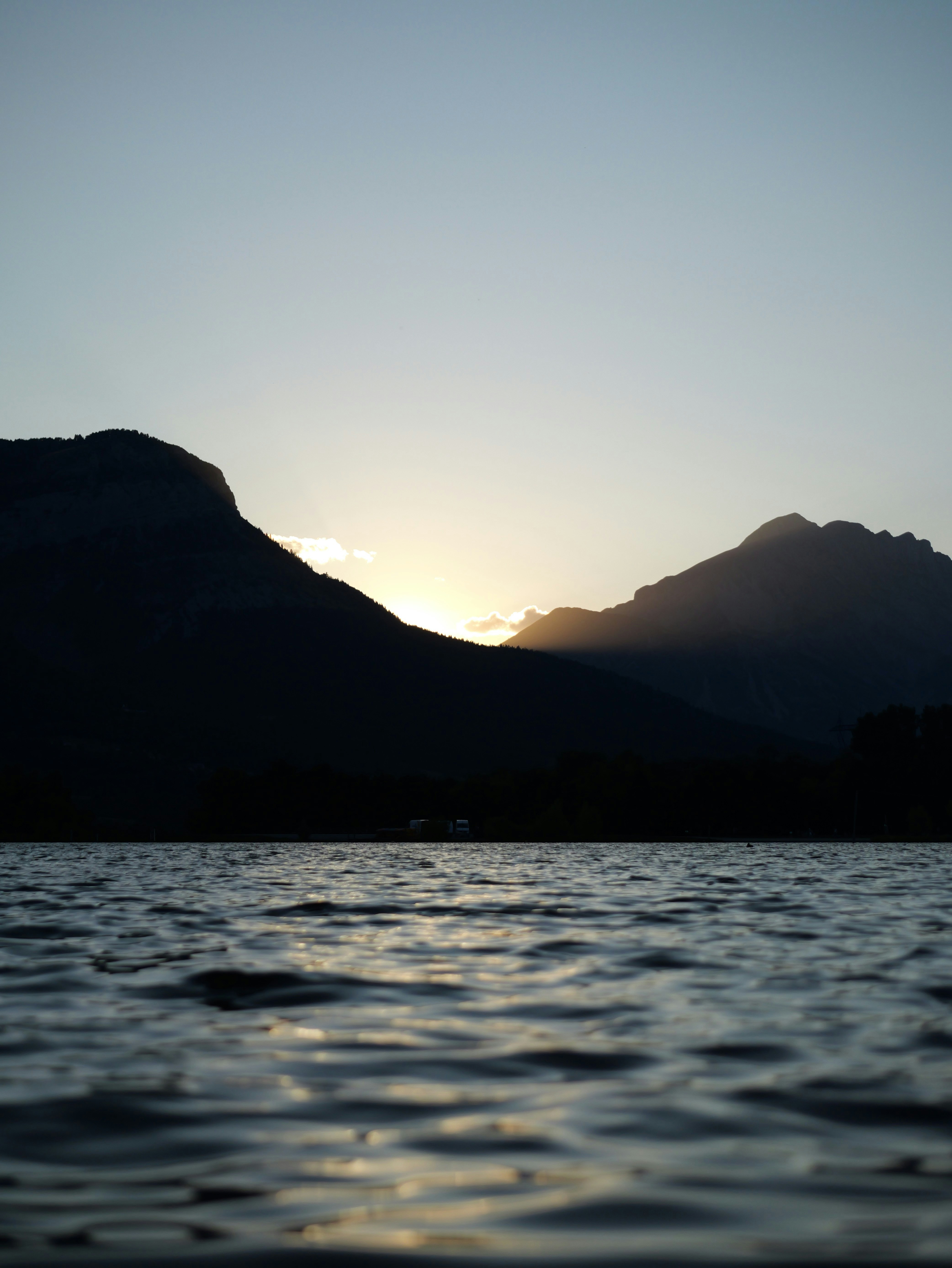 Dawn over Quiet Peaks: A Lake Silhouette Before Light