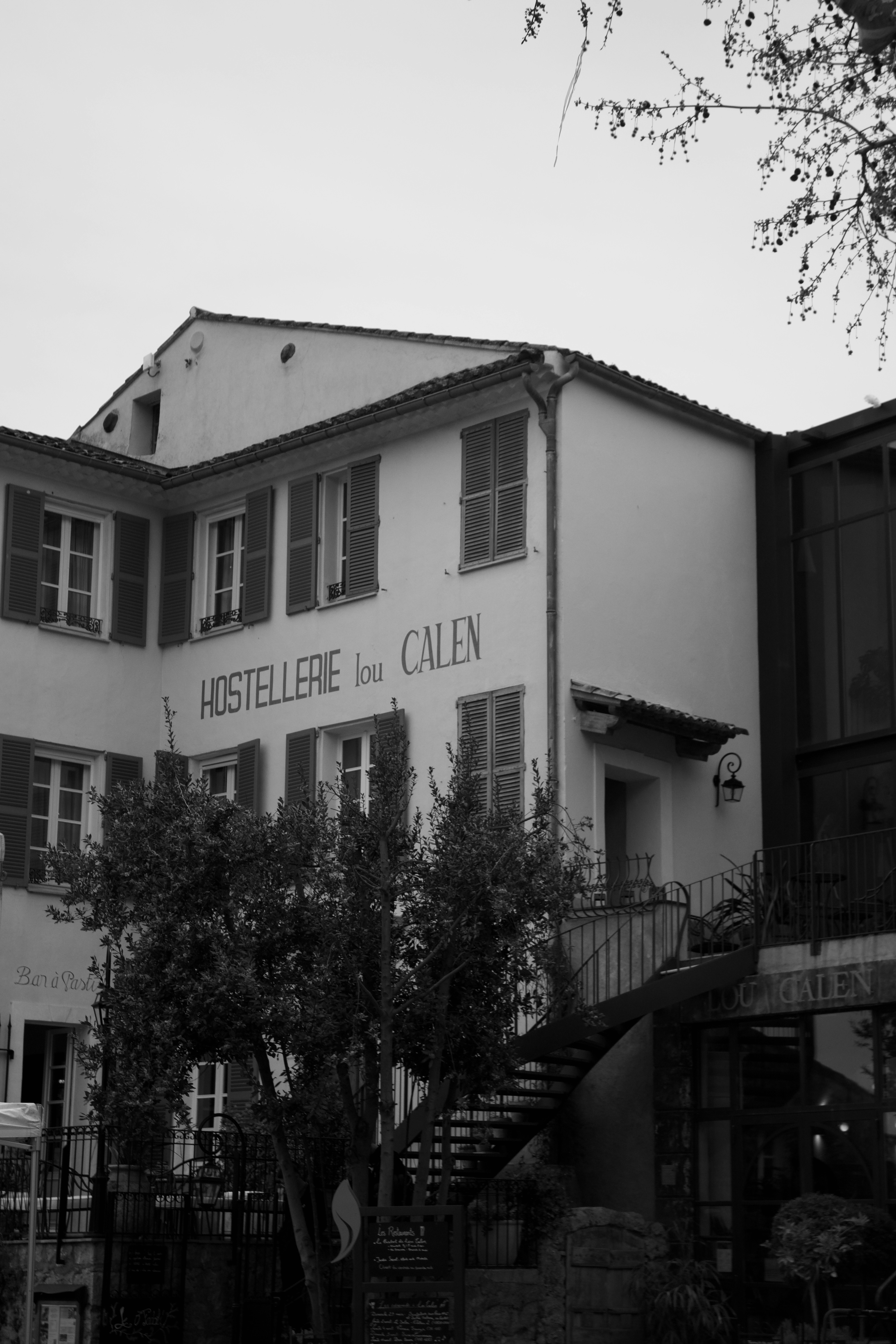 Facade of a French guesthouse: Calen Hostelery in monochrome