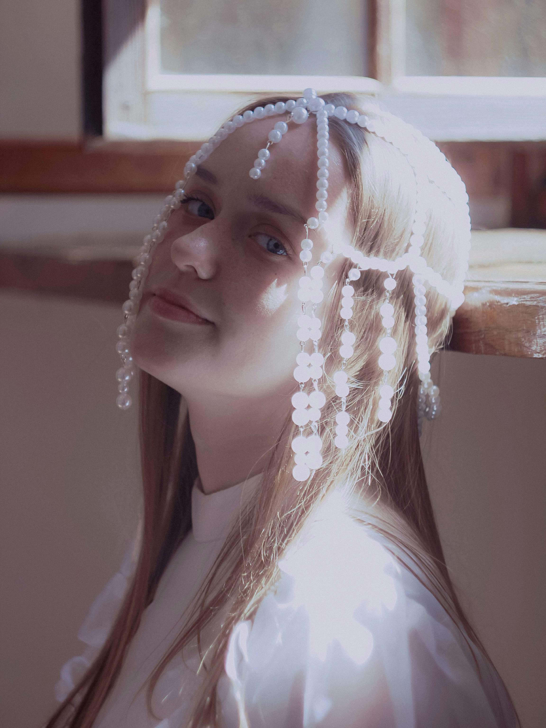 Pearl-Threaded Portrait: Soft Light and Gentle Gaze
