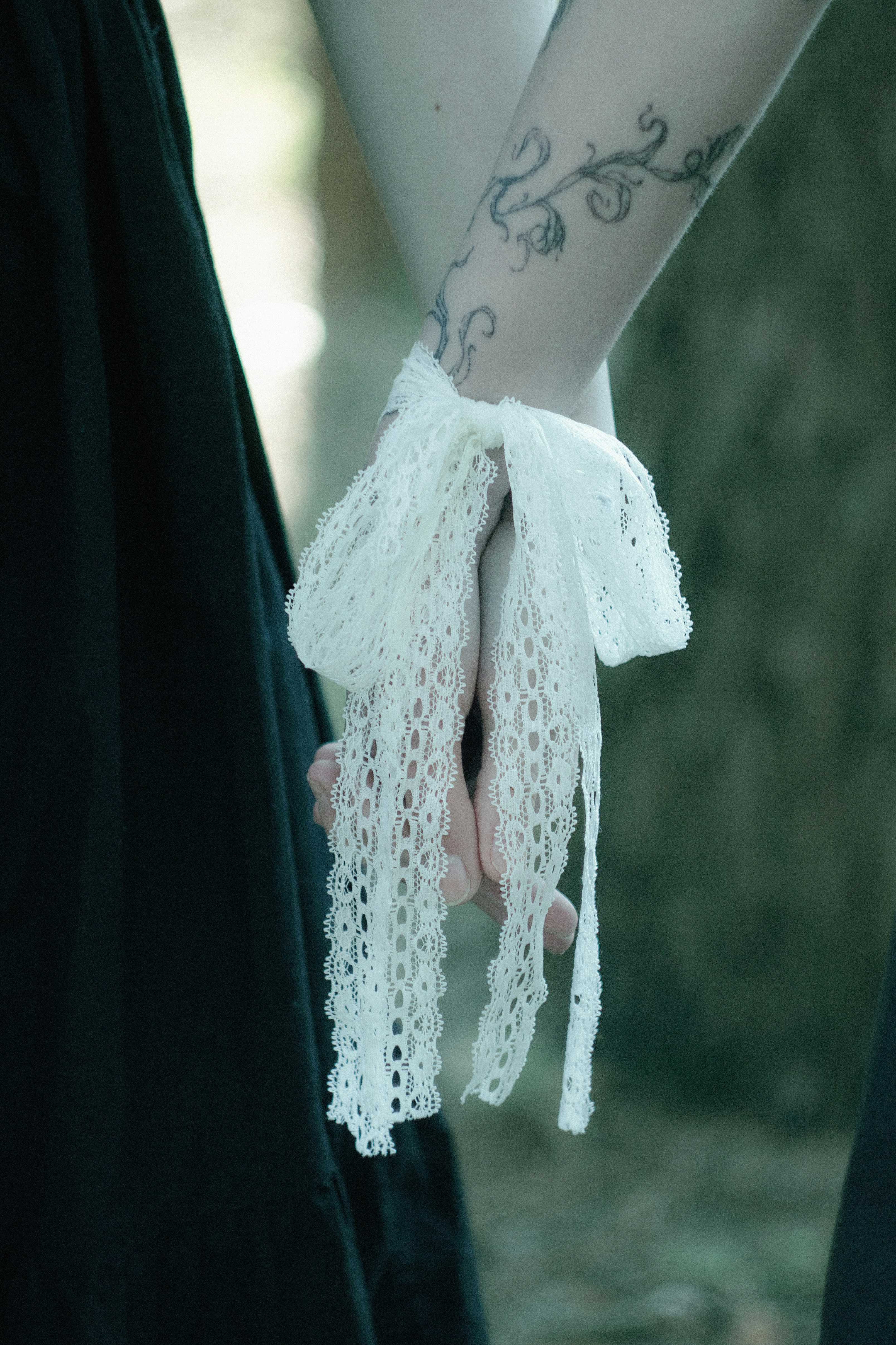 Tied in Lace: A Quiet Moment of Bonded Hands