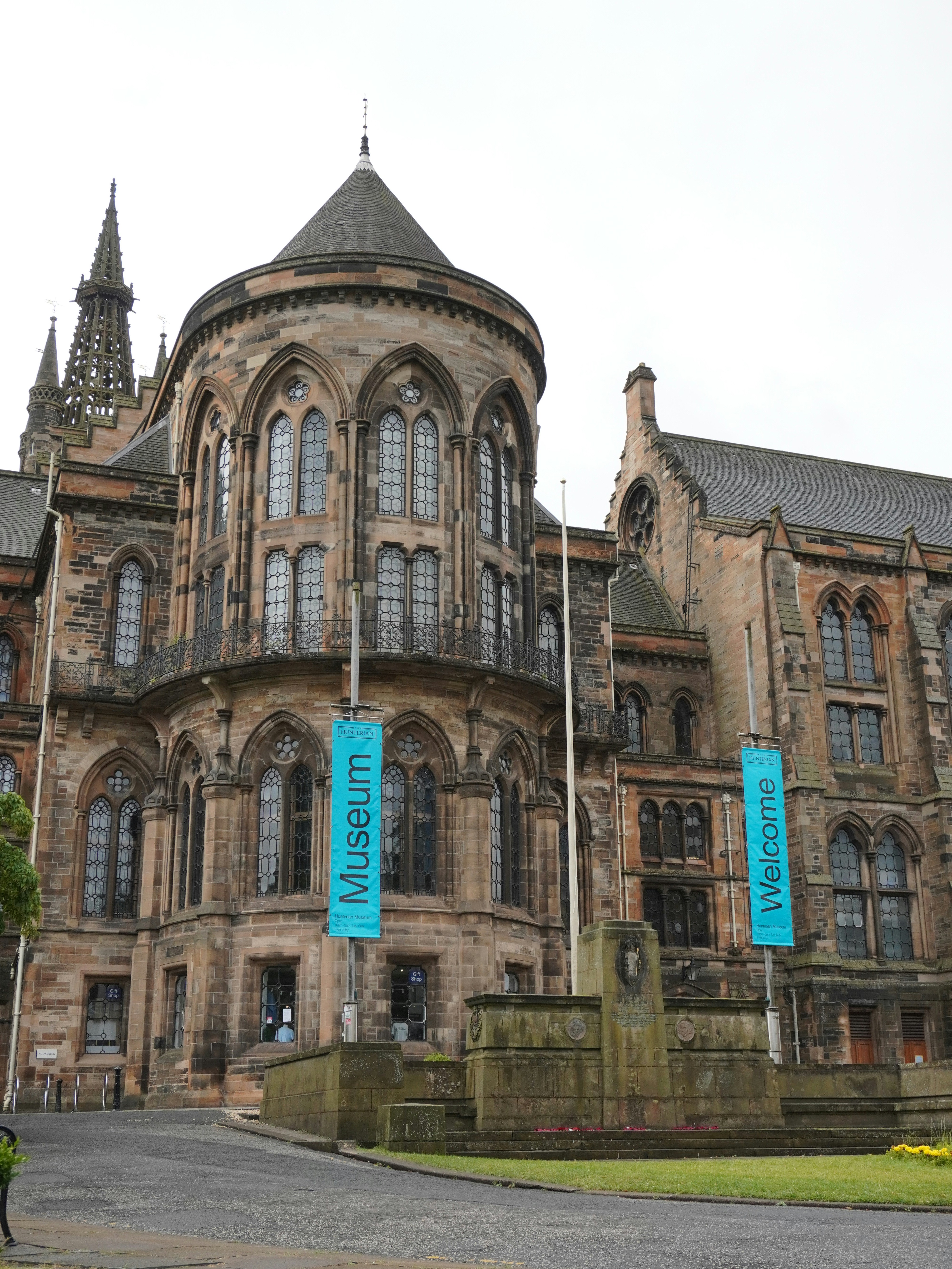 Blue banners and stone arches: a museum façade in view