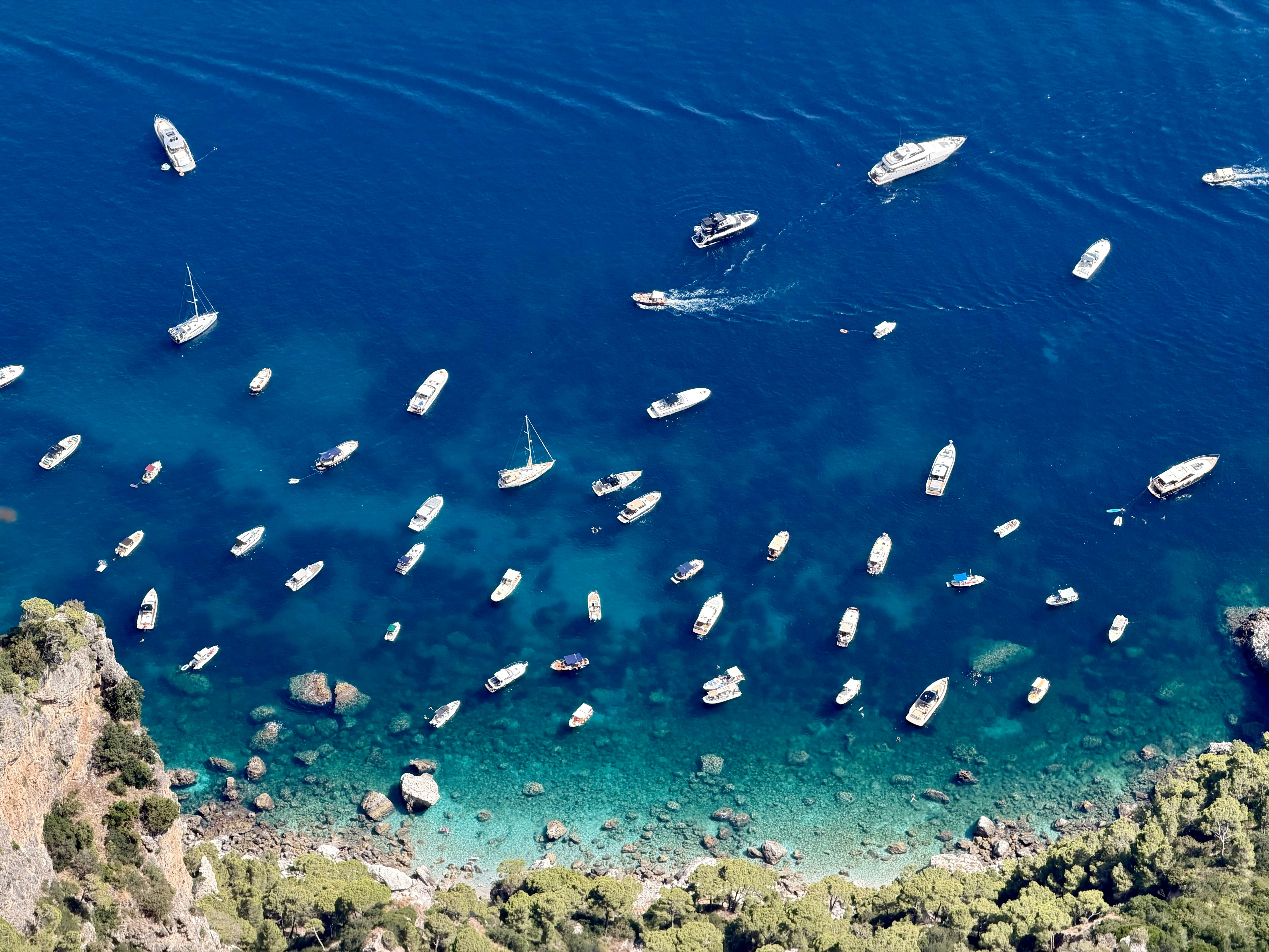 Azure Cove: Boats Casttle on a Sliver of Shore