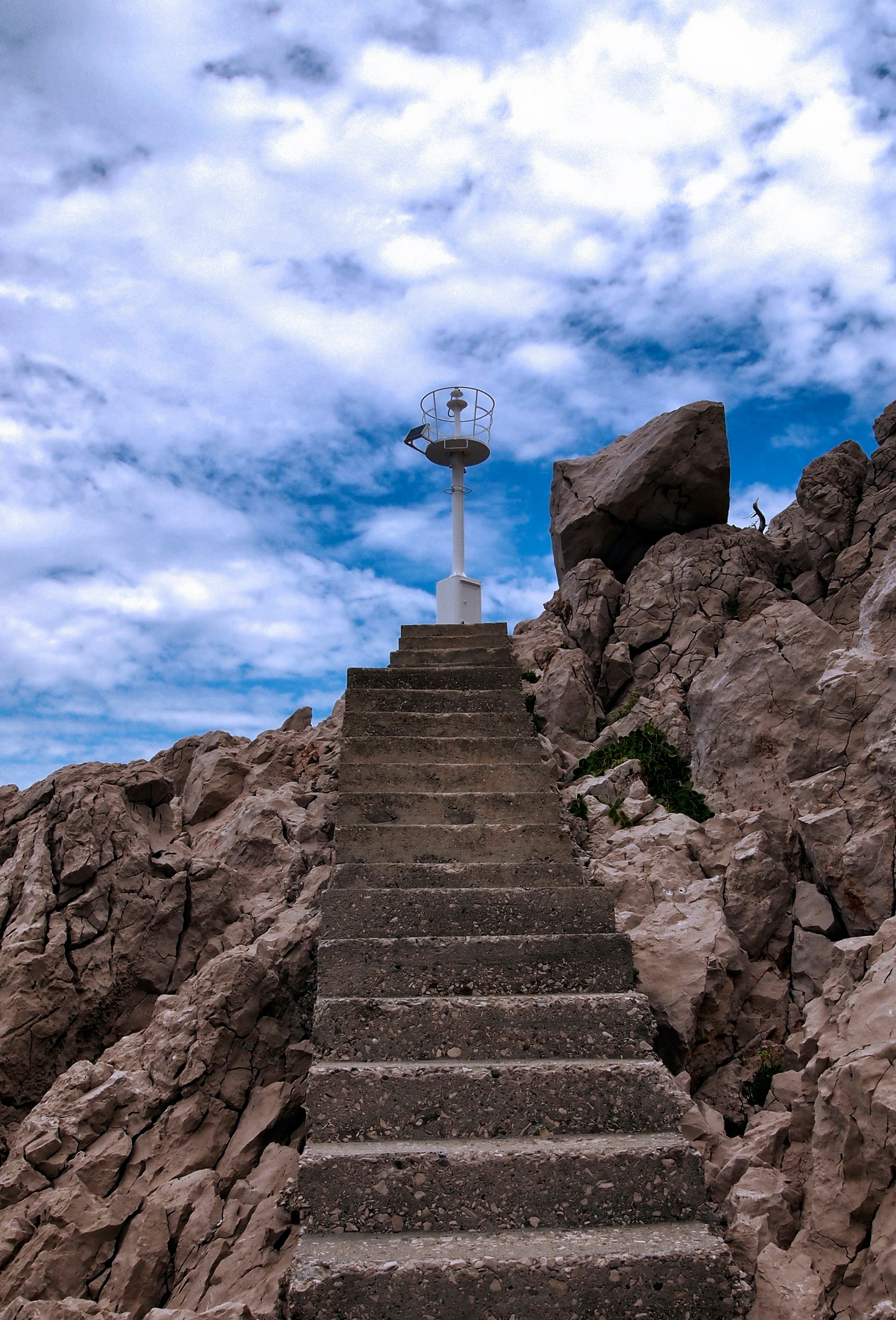 Staircase to the Sky: A rocky ascent under a bright blue canopy
