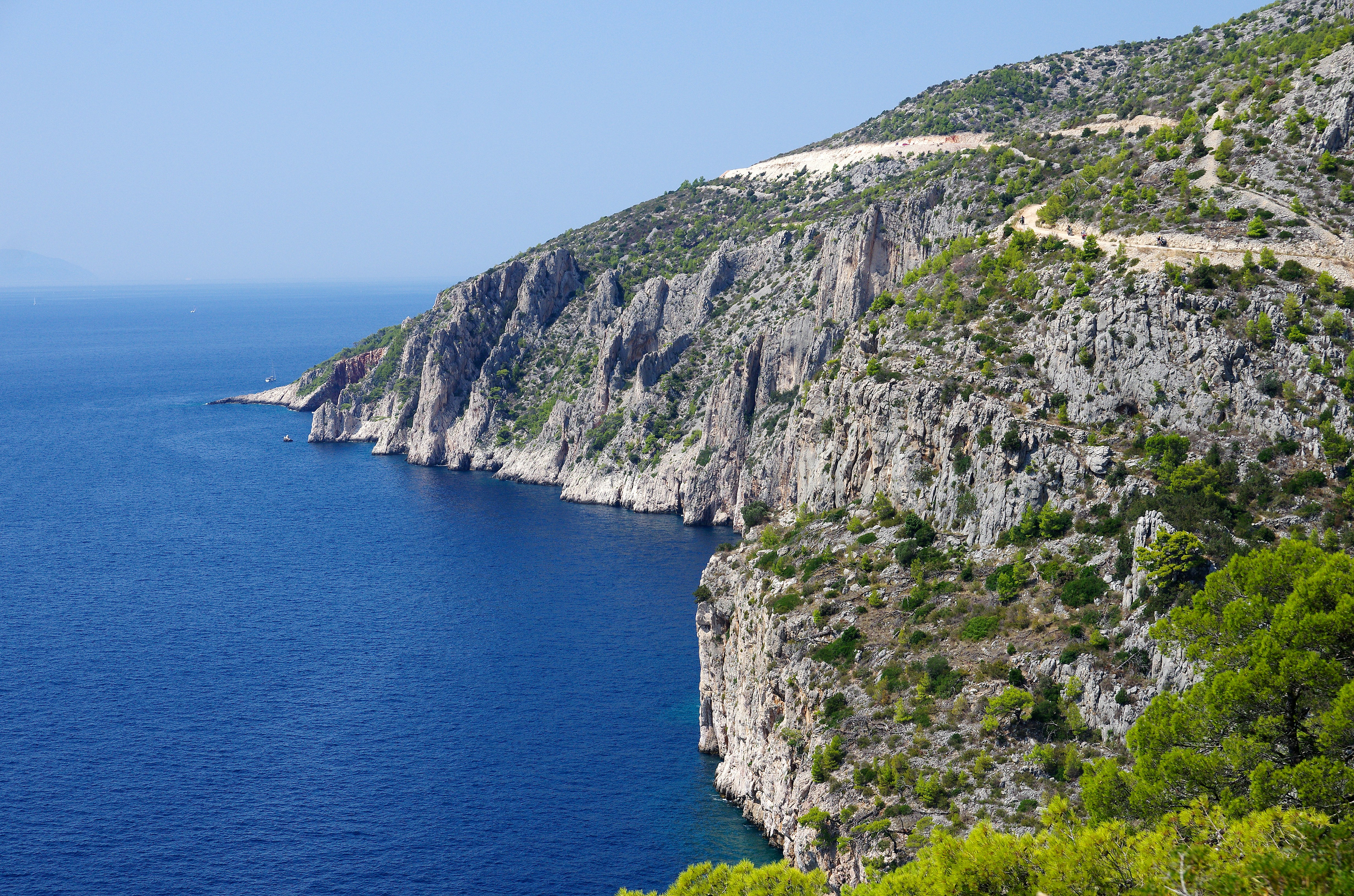 Azure cliffs and sea: a sunlit coastal panorama