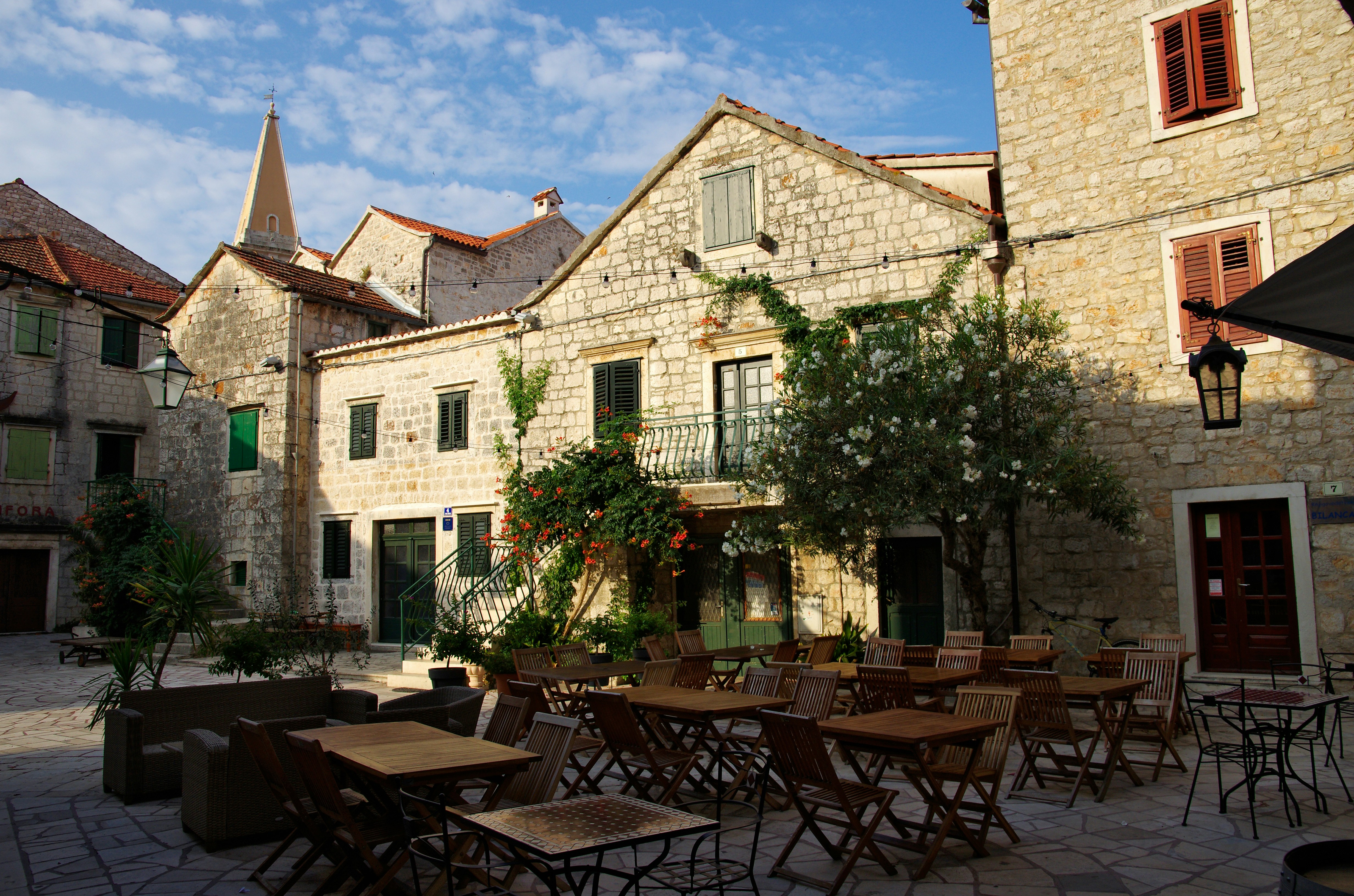 Cobbled Square Serenade: Sunlit Stone Facades and Evening Arrangements