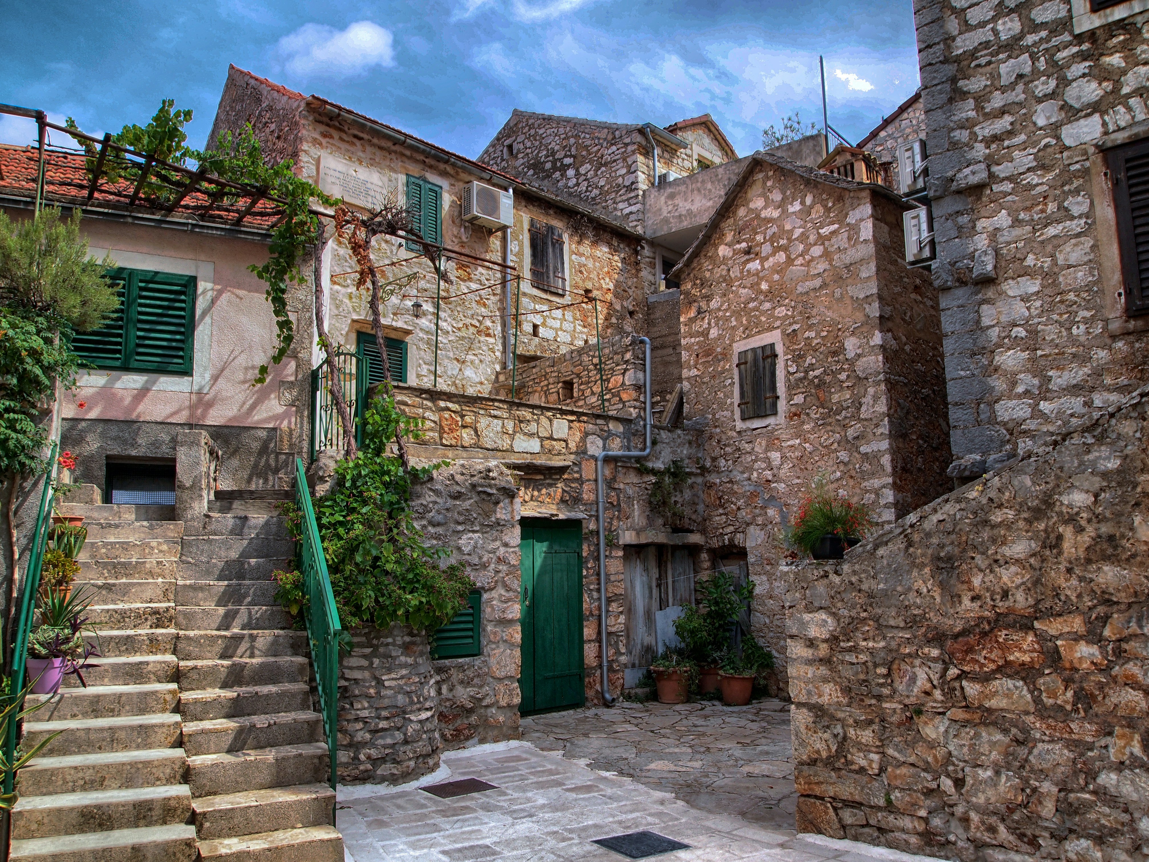 Stone Village Staircase to a Green Doorway
