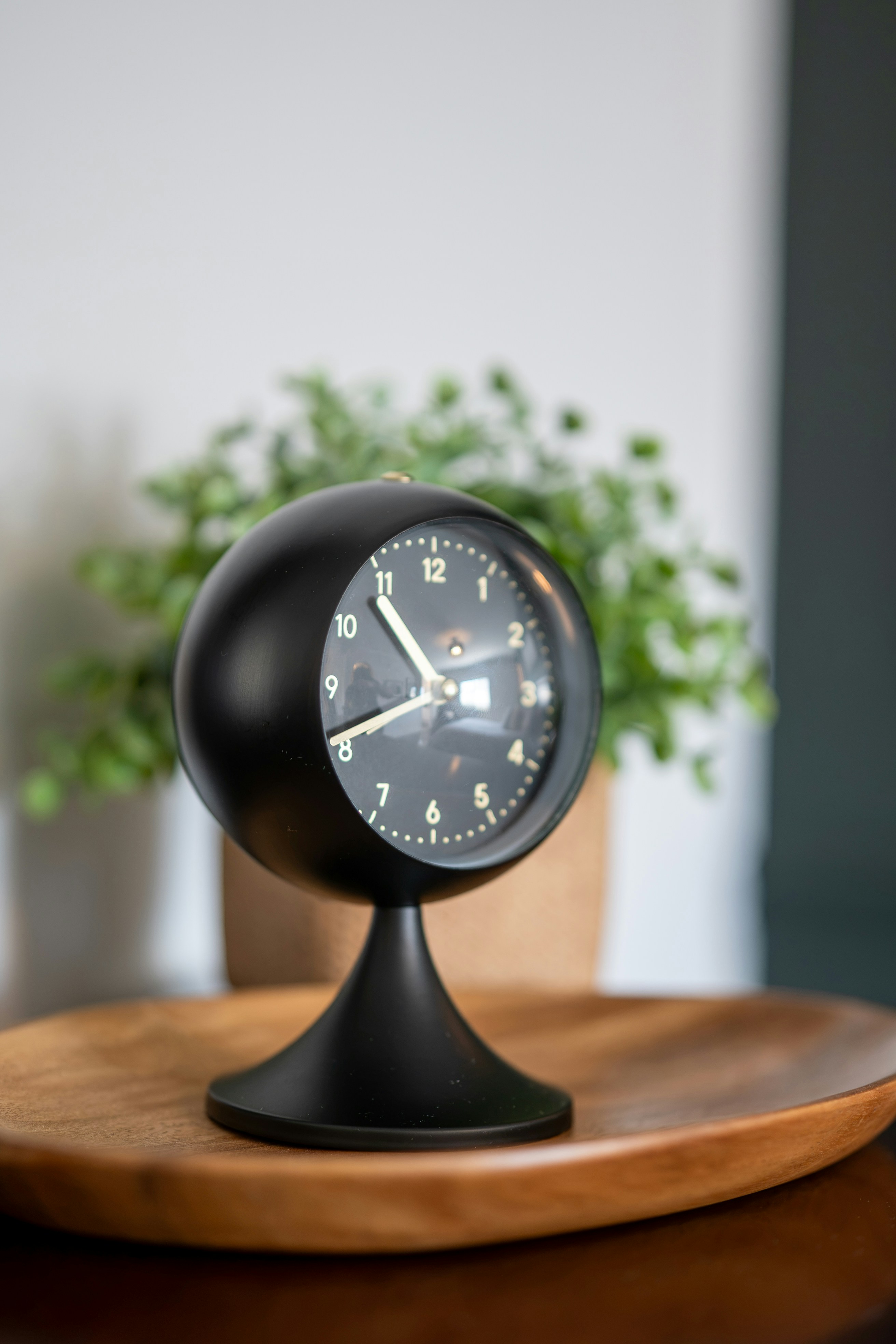 Midnight Muse: A Curved Clock Gaze on a Wooden Stage