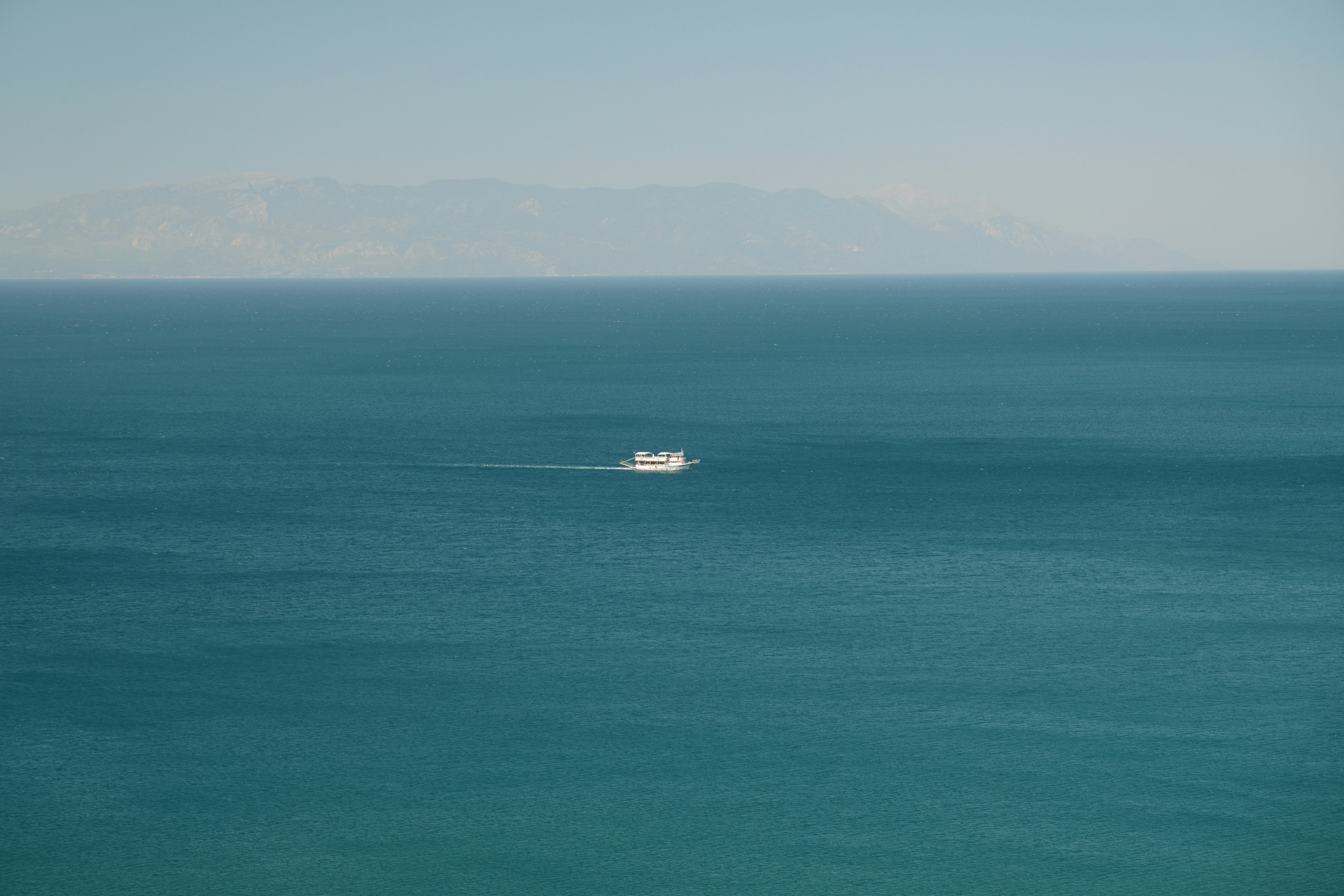 Mid-Sea Vessel in a Tranquil Blue Expanse