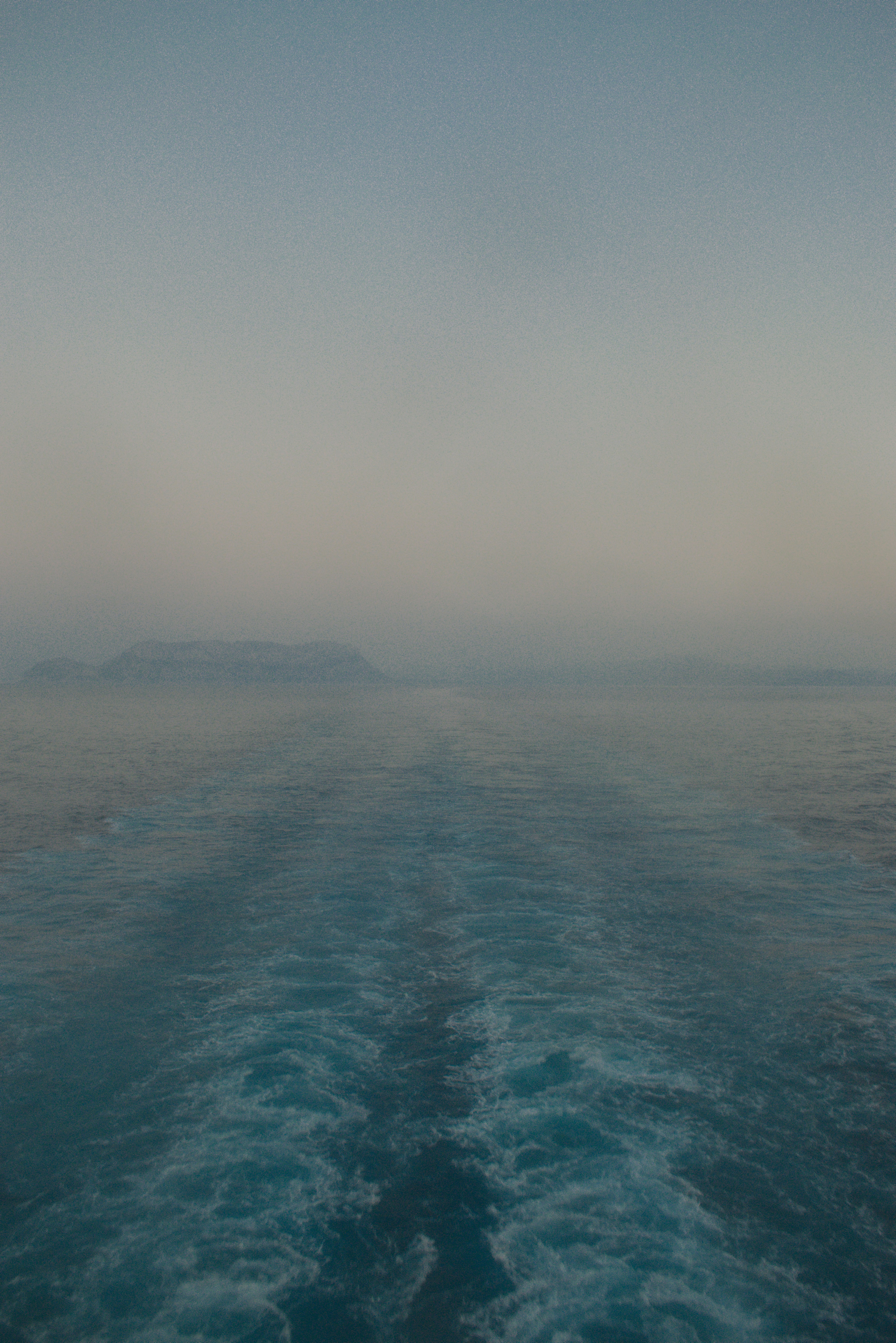 Vast Horizon Afterwake: Turquoise Wake Toward Distant Shore