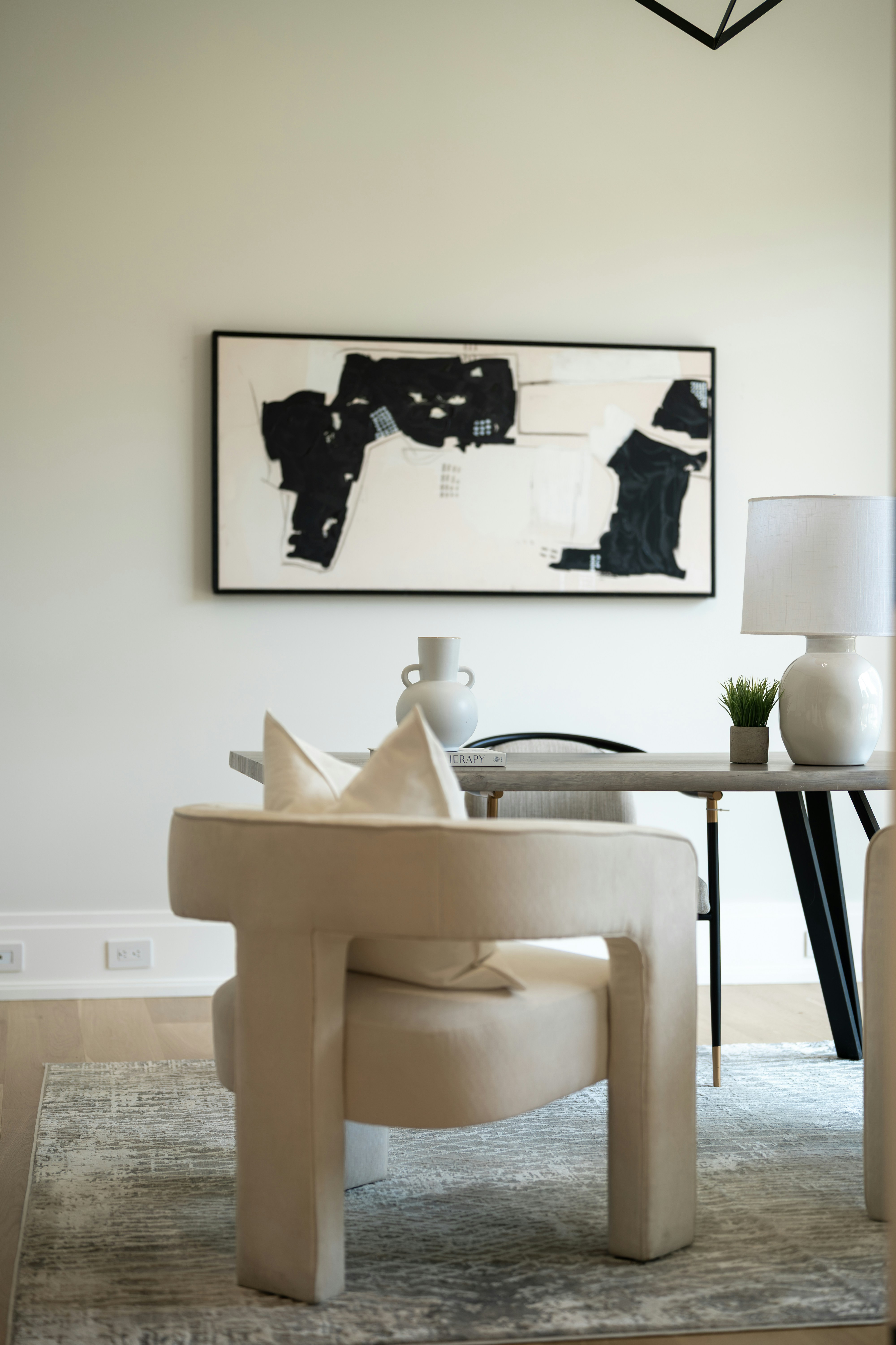 Minimalist Dining Nook with Abstract Wall Art