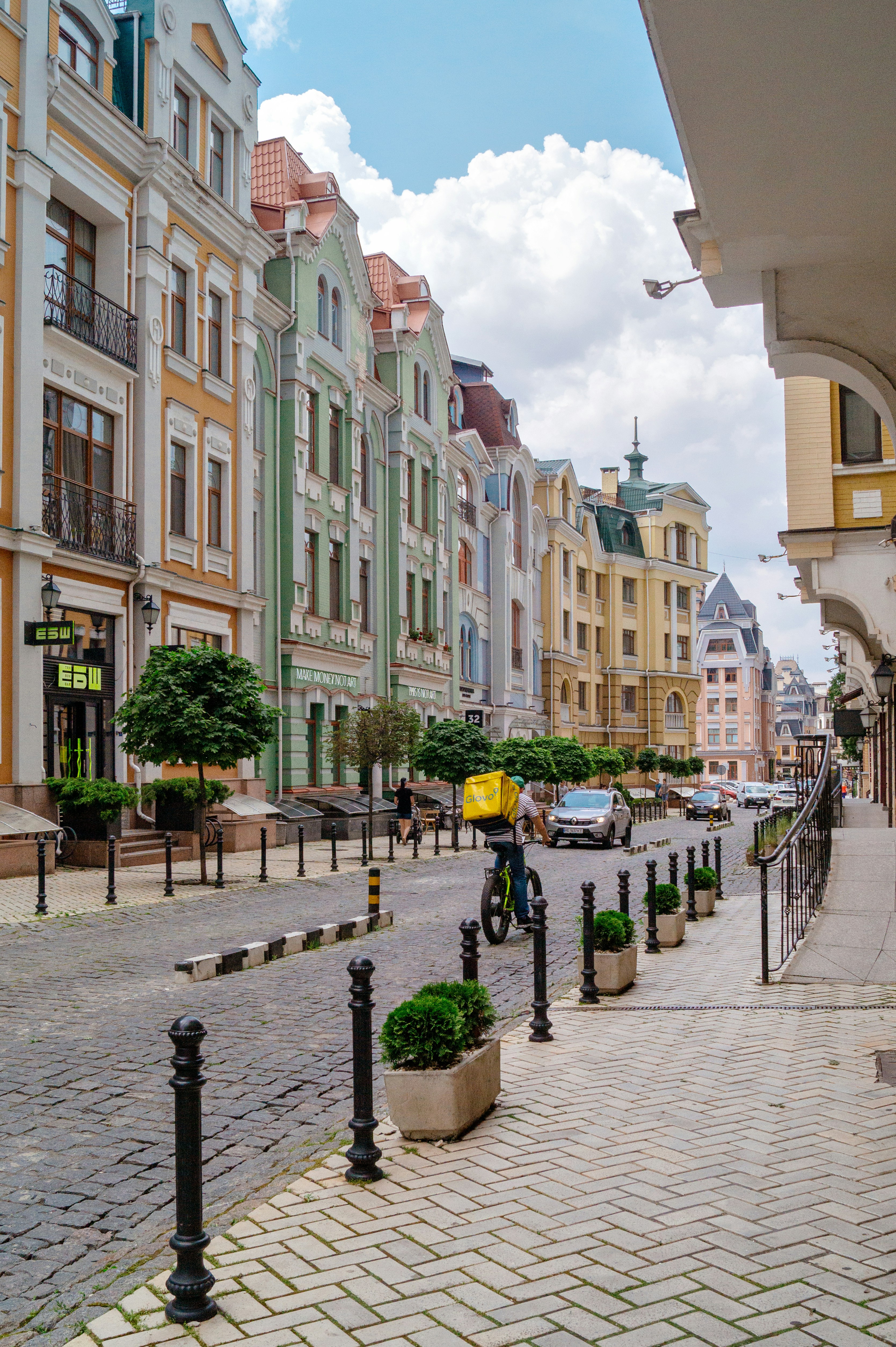 Colorful European Street with a Delivery Rider