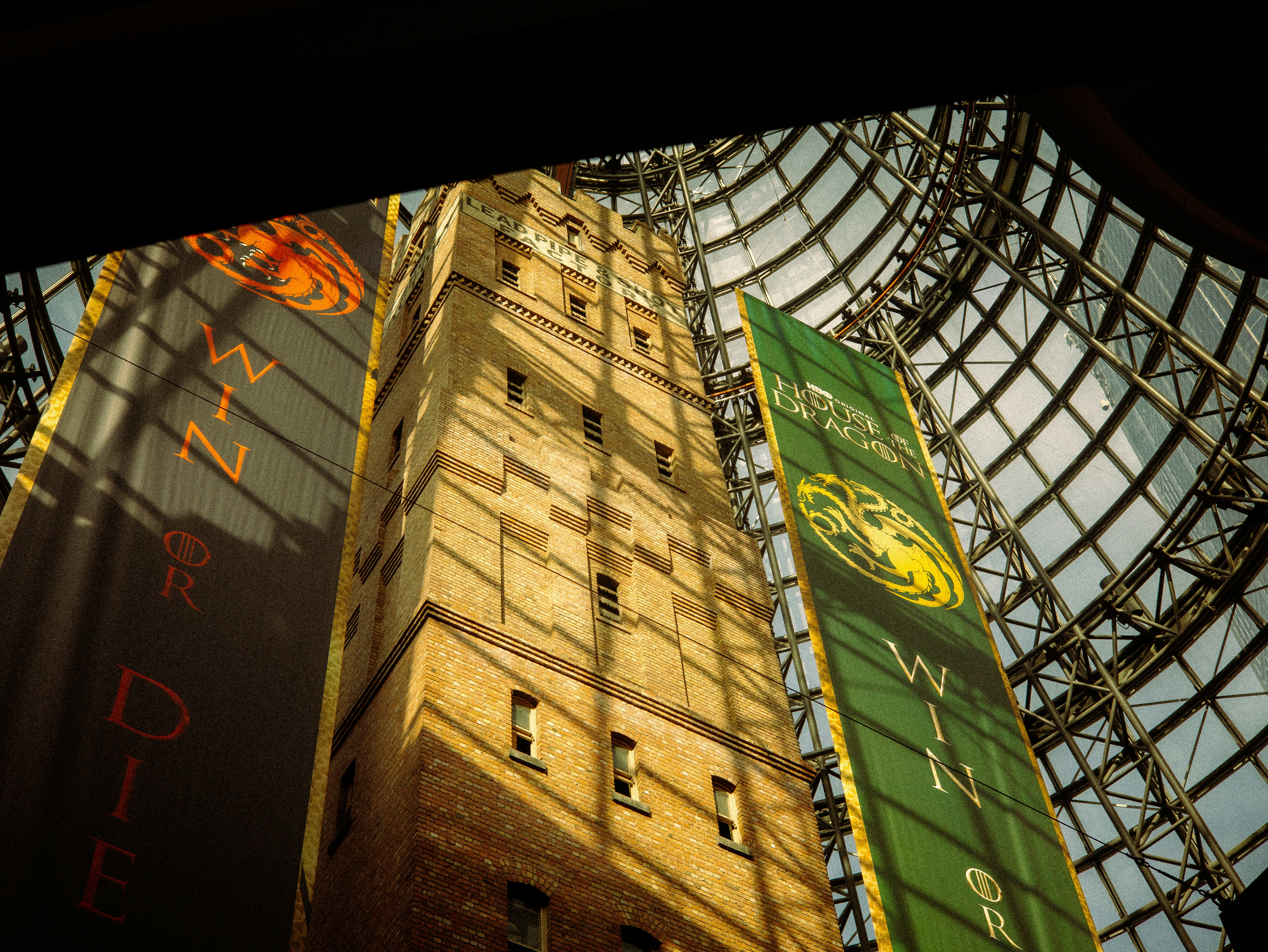 Vertical Banner Cathedral: A Brick Tower Reaches Toward the Glass Dome
