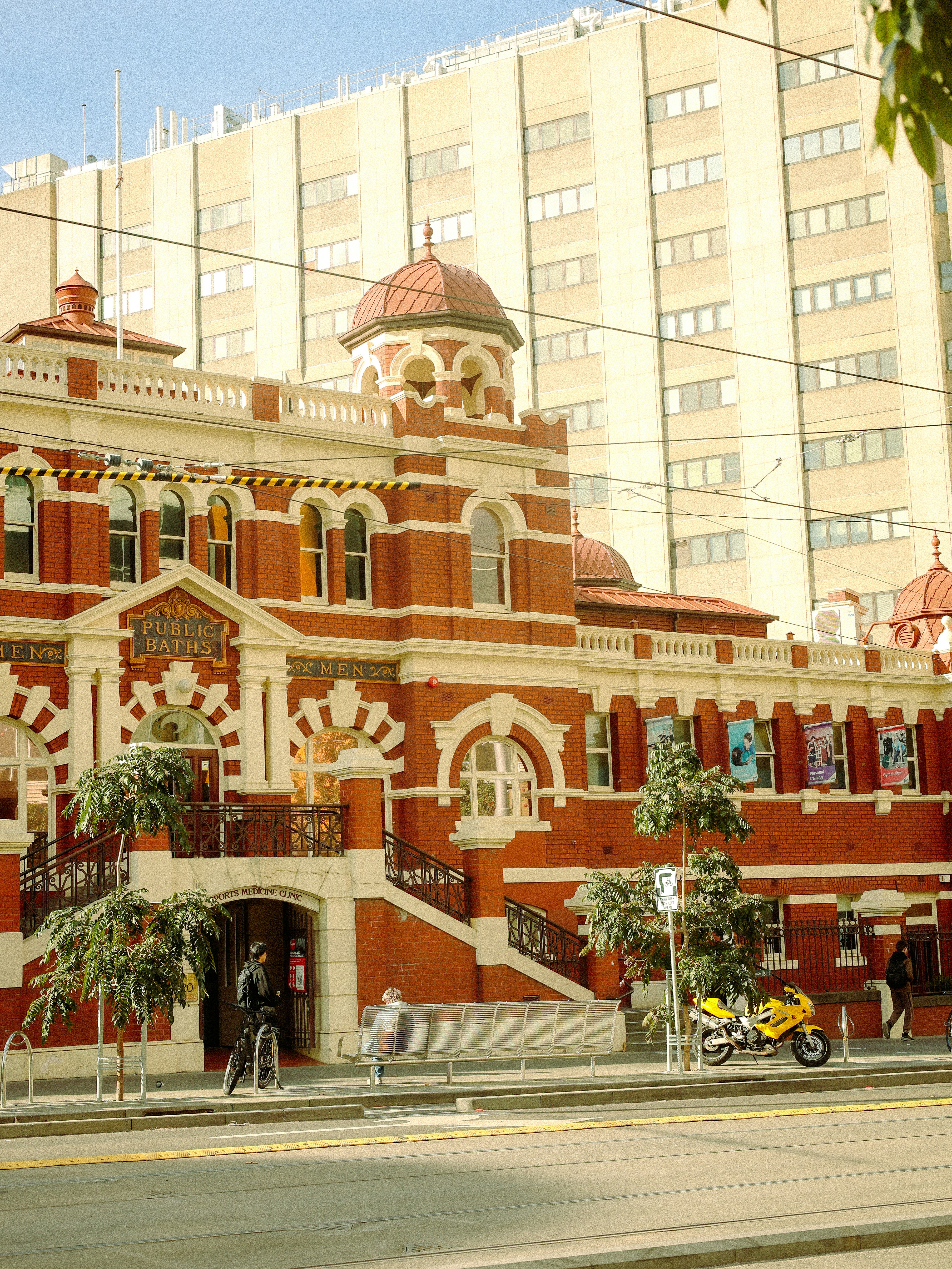 Victorian Red-brick Public Baths Nestled Against a City Highrise