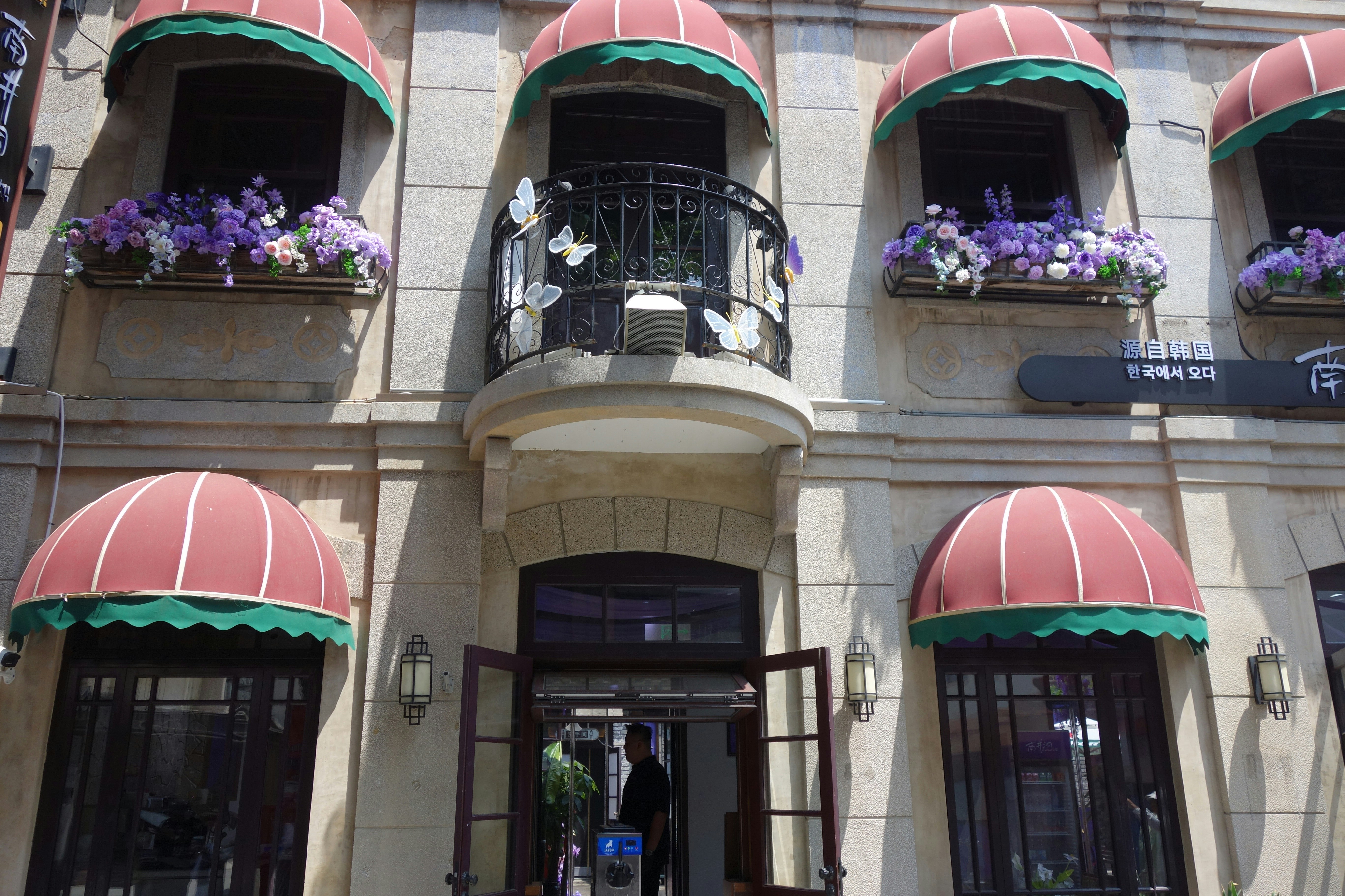 Cafe Facade with Velvet Awnings: A Charming European Revival