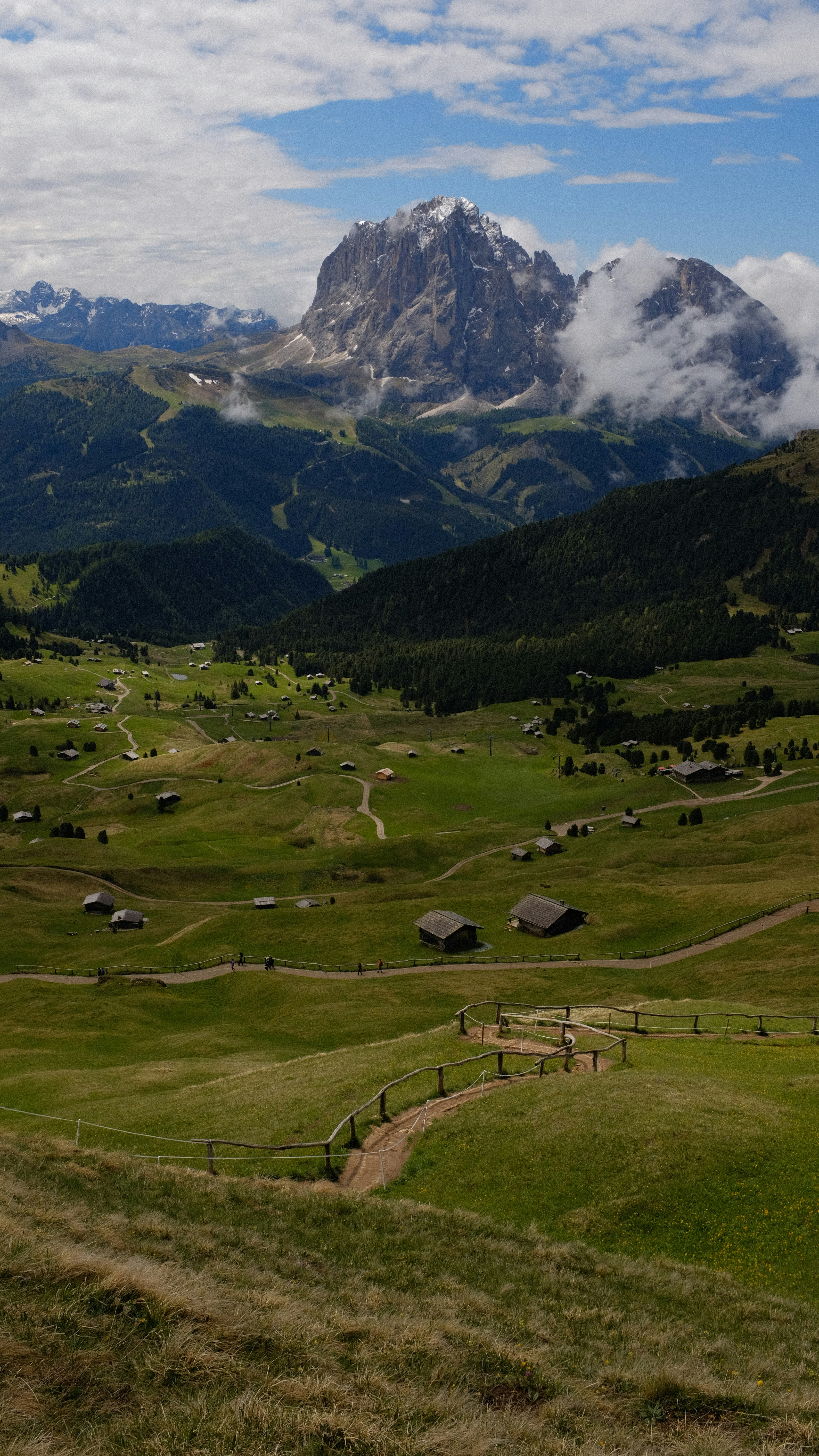 Stone Crown Over the Valley: A Mountain Village Panorama