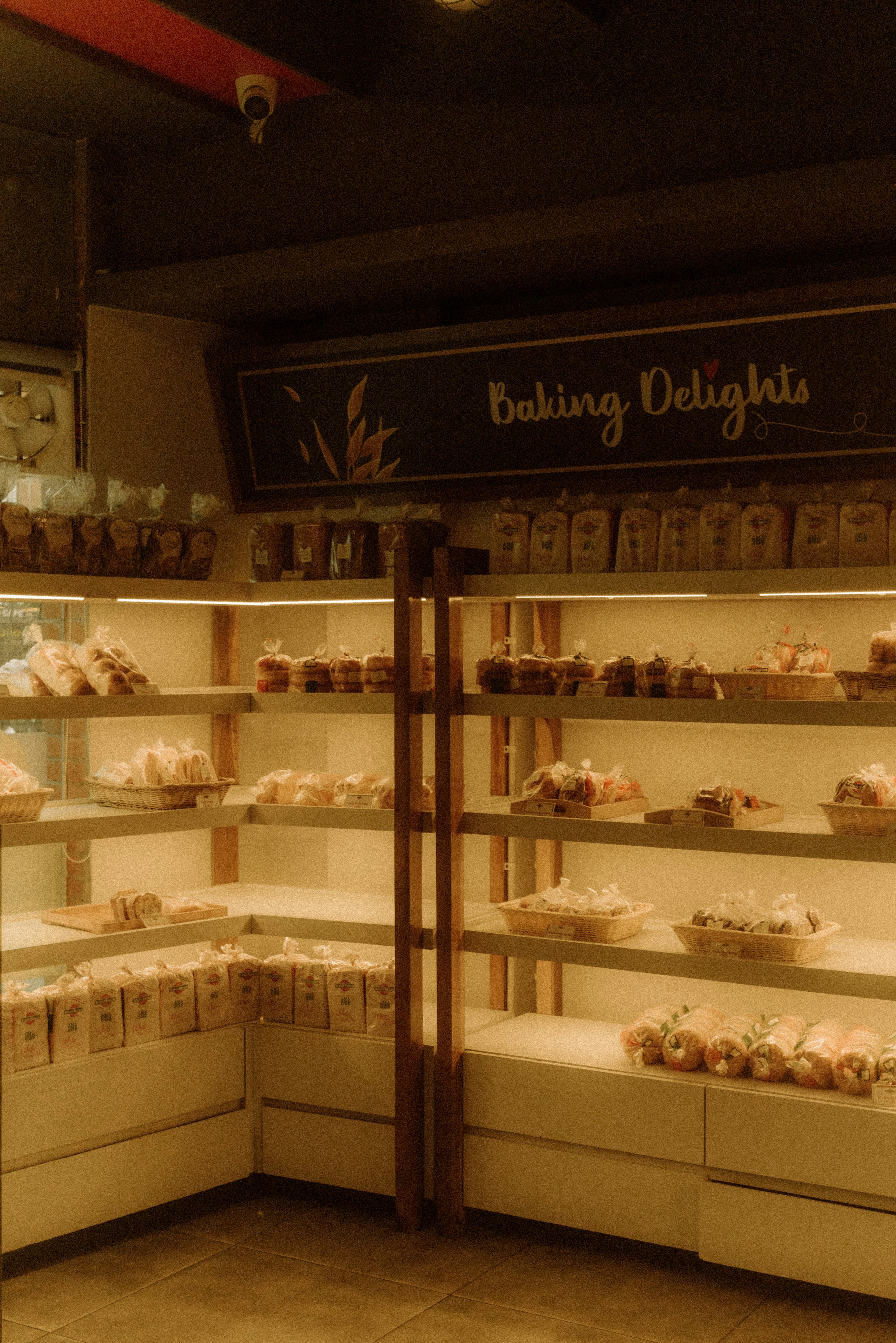 Silent Bakery Display: Warm Glow Over Empty Shelves