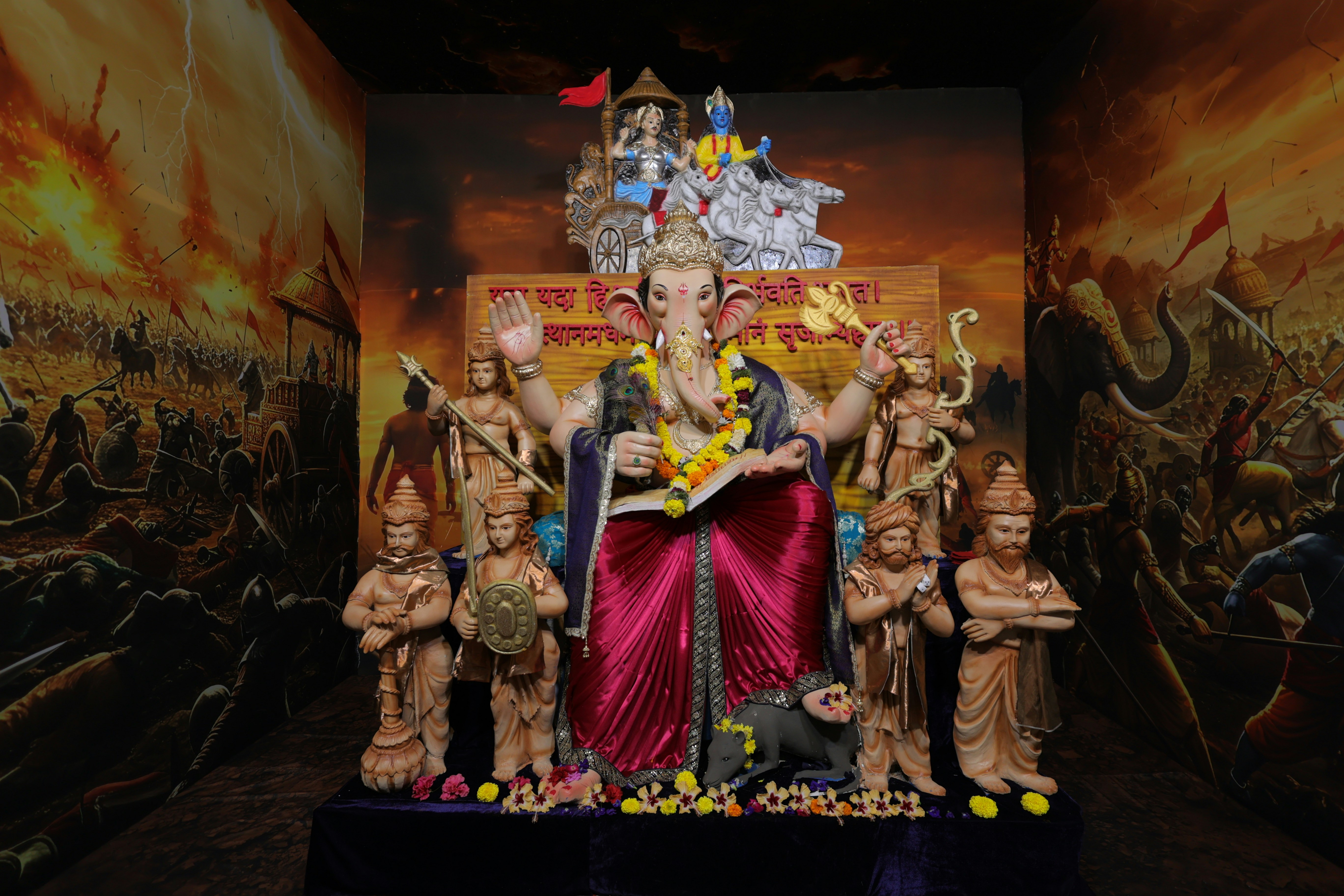 Vibrant Shrine: A Central Goddess Surrounded by Bronze Statues