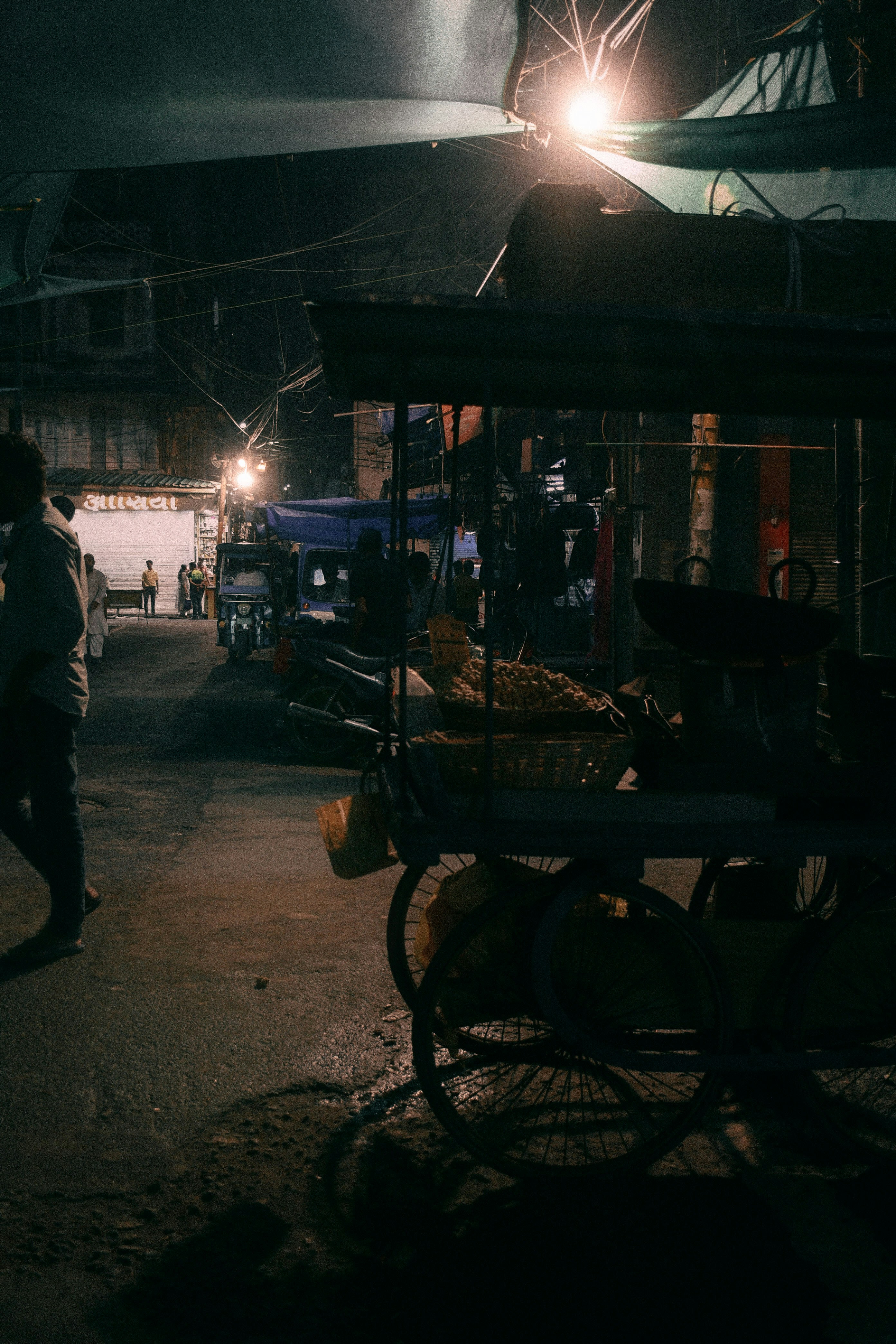 Night Market Silhouettes Under Neon Canopy