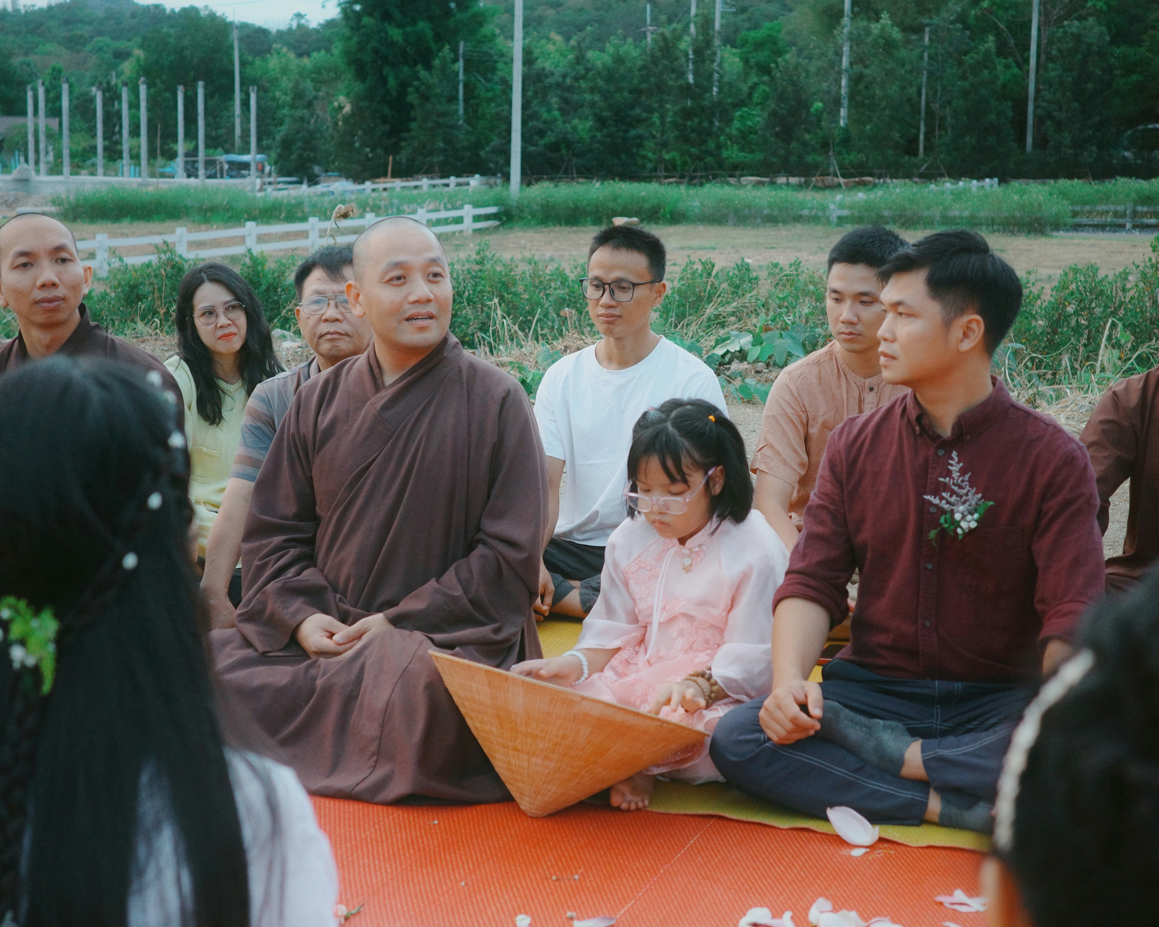 A Quiet Moment of Ceremony: A Monk Guides a Family in Song