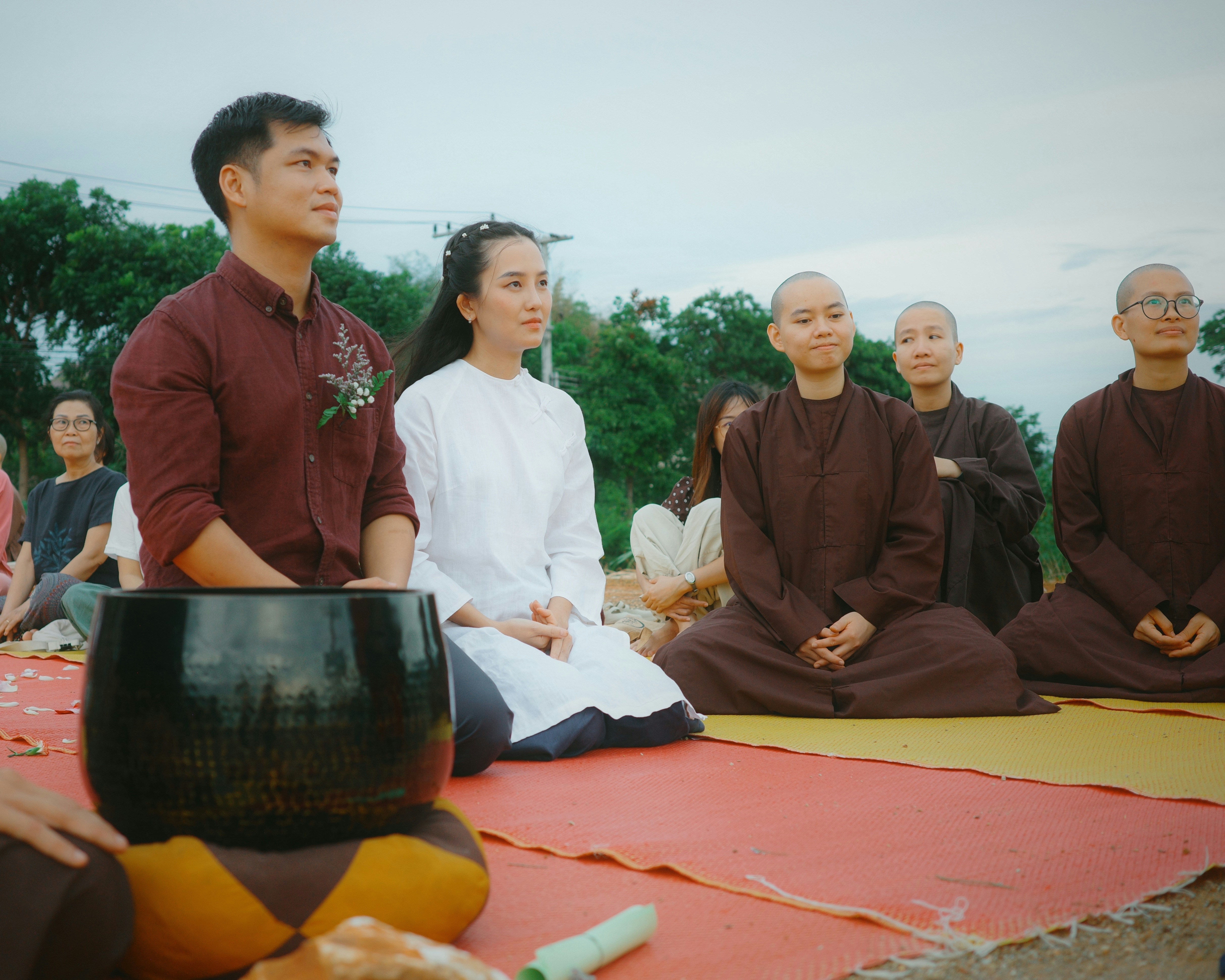 Calm Assembly: A Quiet Moment Among Monks and Visitors