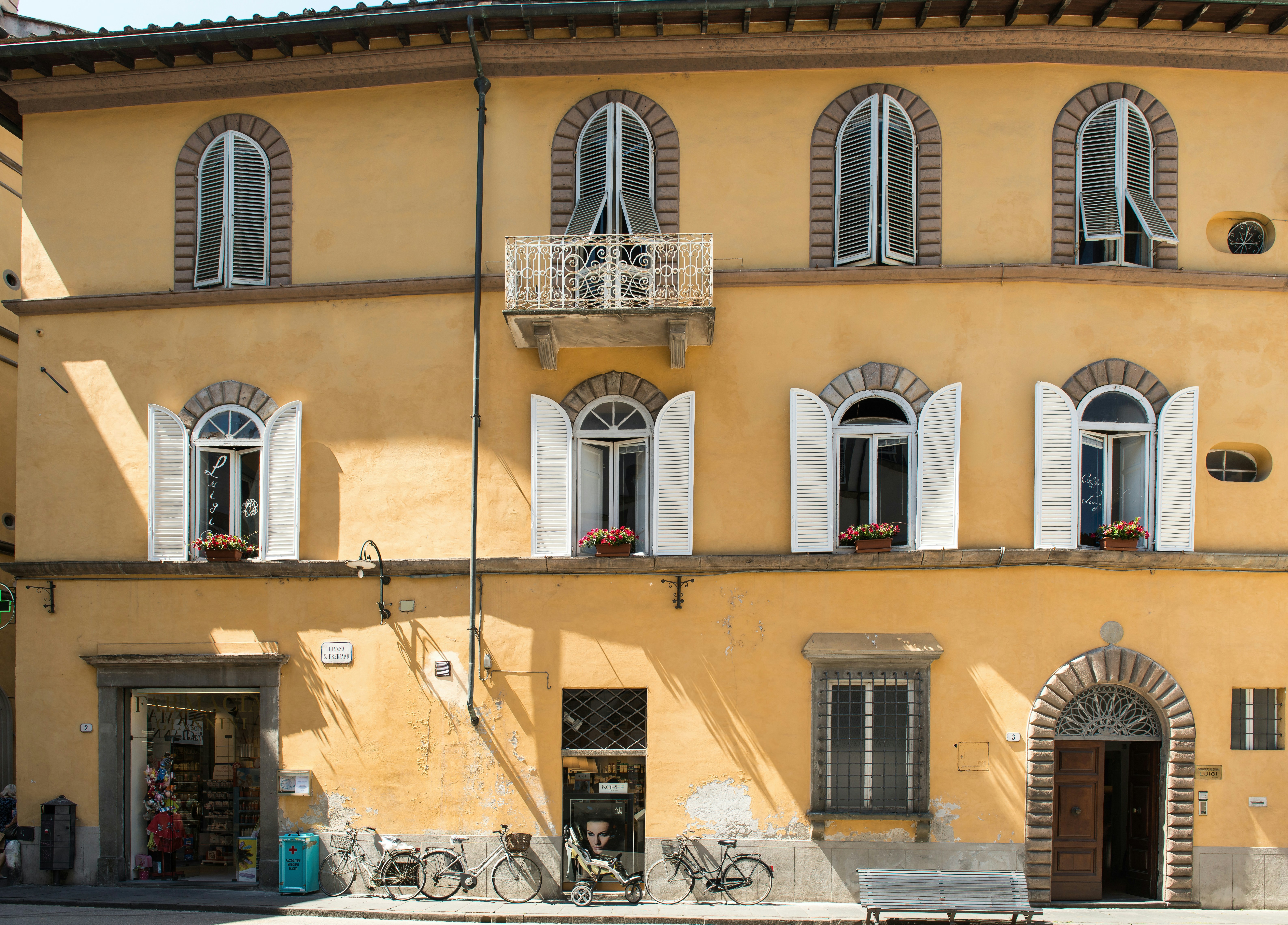 Sunlit Facade Confidential: A Quiet Italian Street Scene