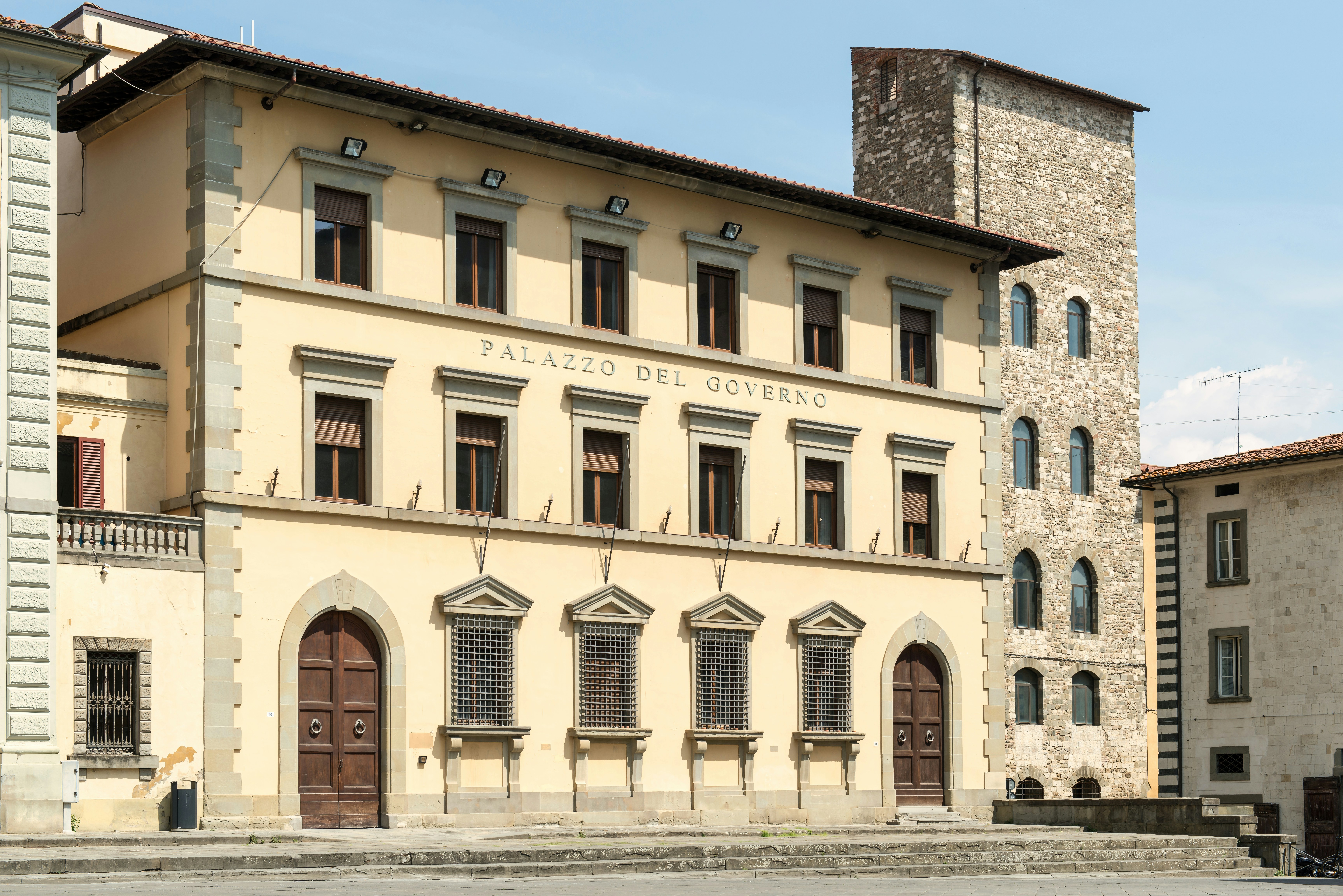 Facade of Palazzo del Governo: sunlit Milan-inspired Tuscan town hall